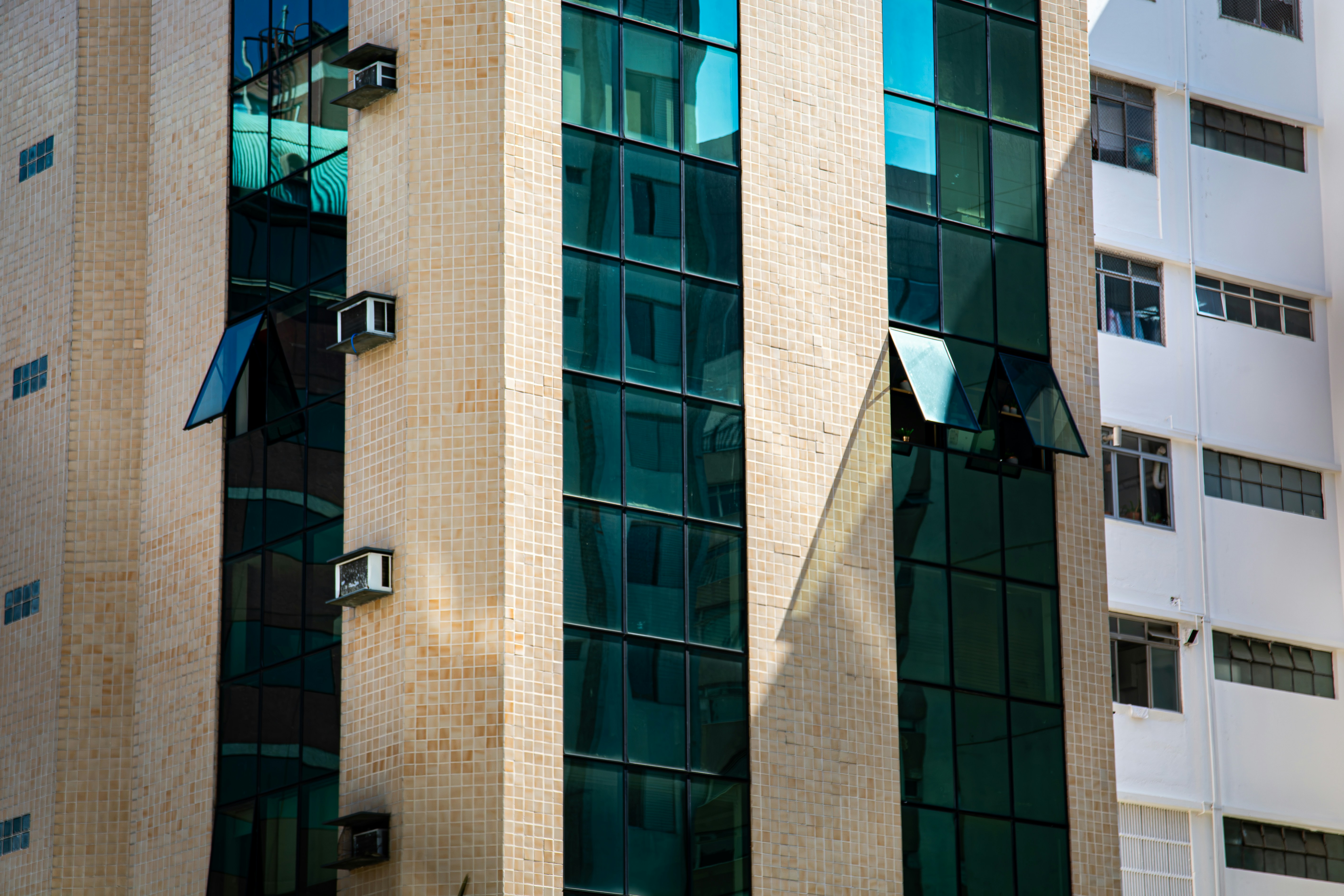 Glass and Brick Facade: Parallel Shadows on a Modern Building