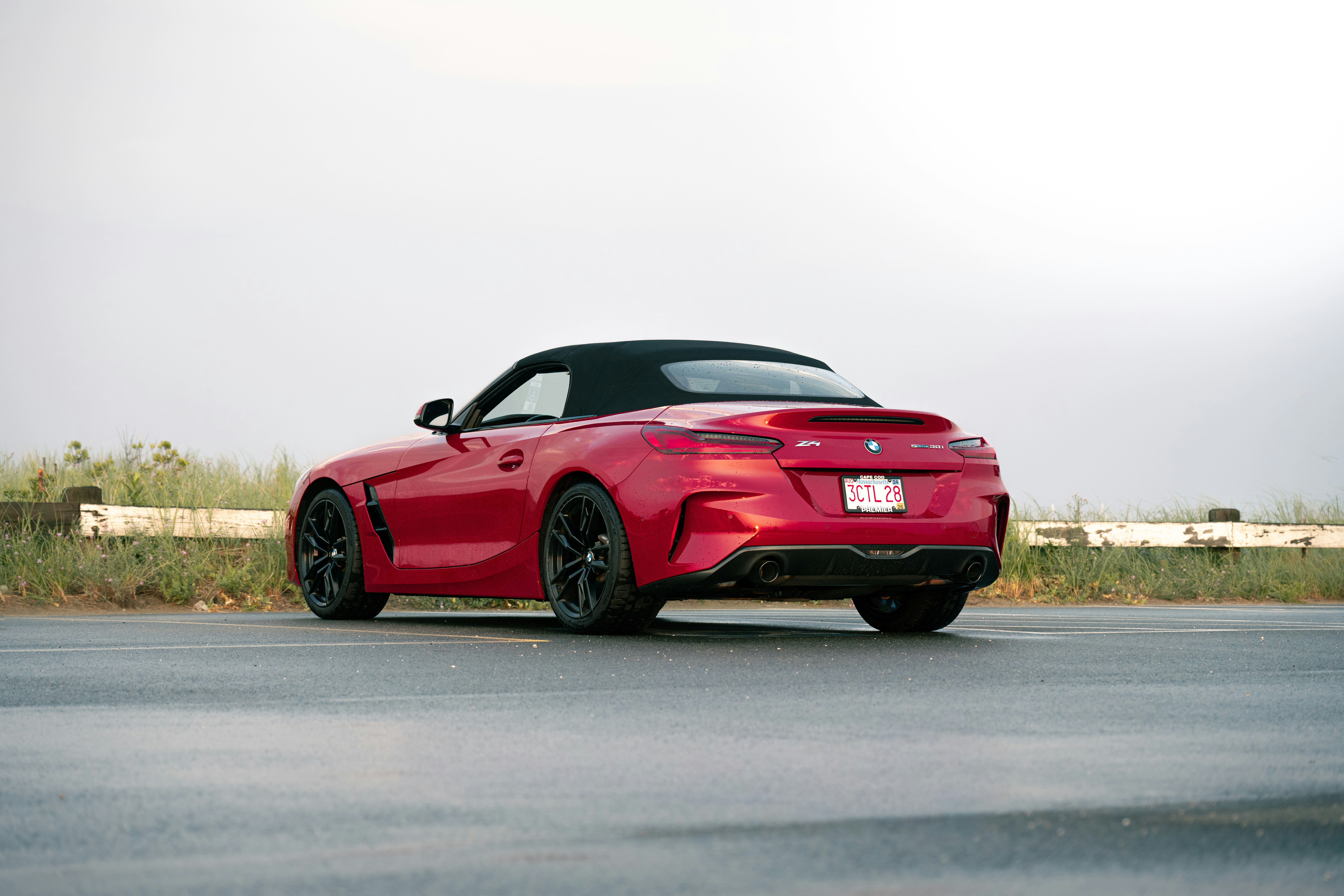 Red Aero: A Convertible Stance on an Open Road