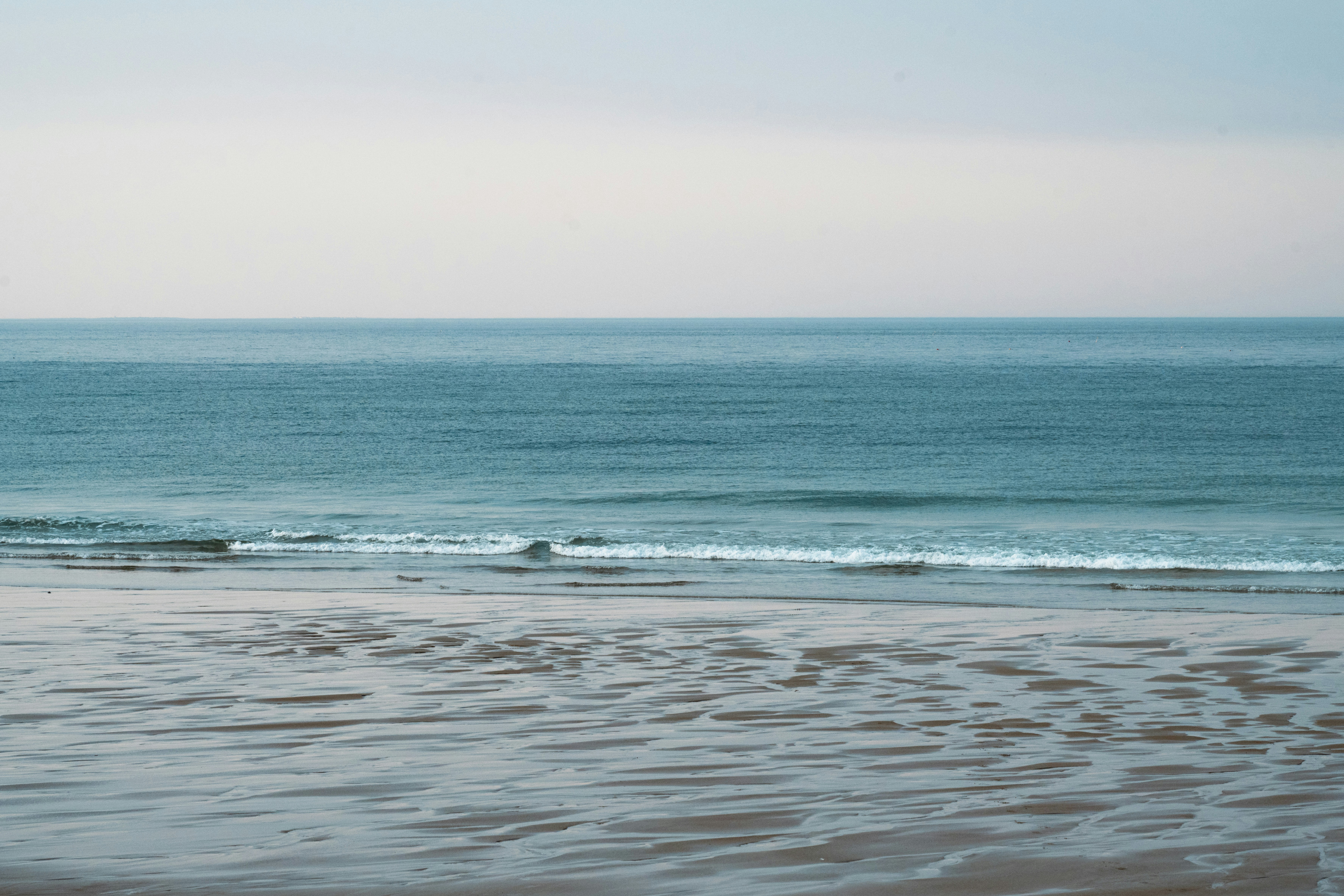 Horizon Quiet: Gentle Tide at a Coastal Shore