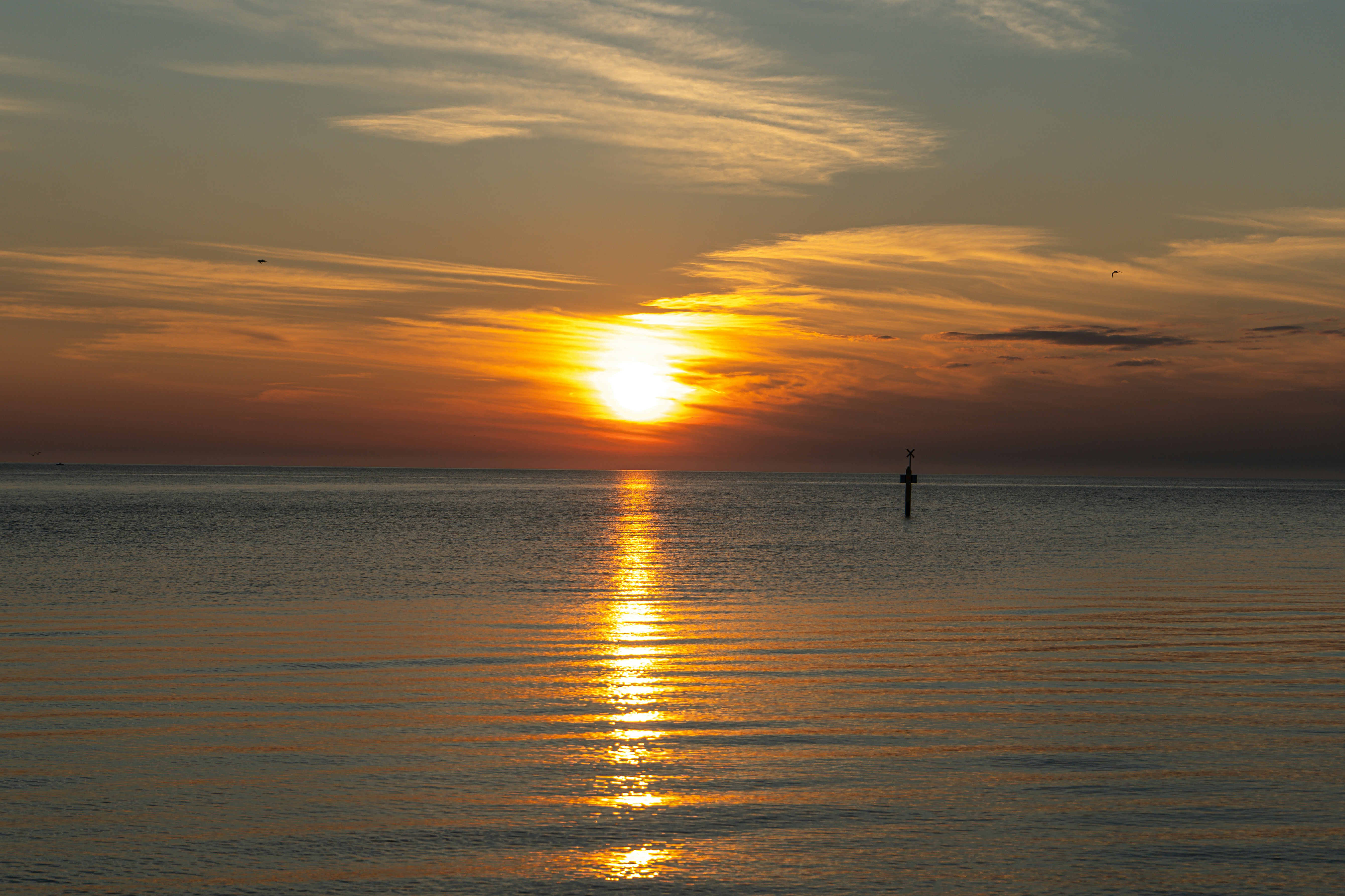 Sunlit Horizon: The Quiet Vessel at Dusk