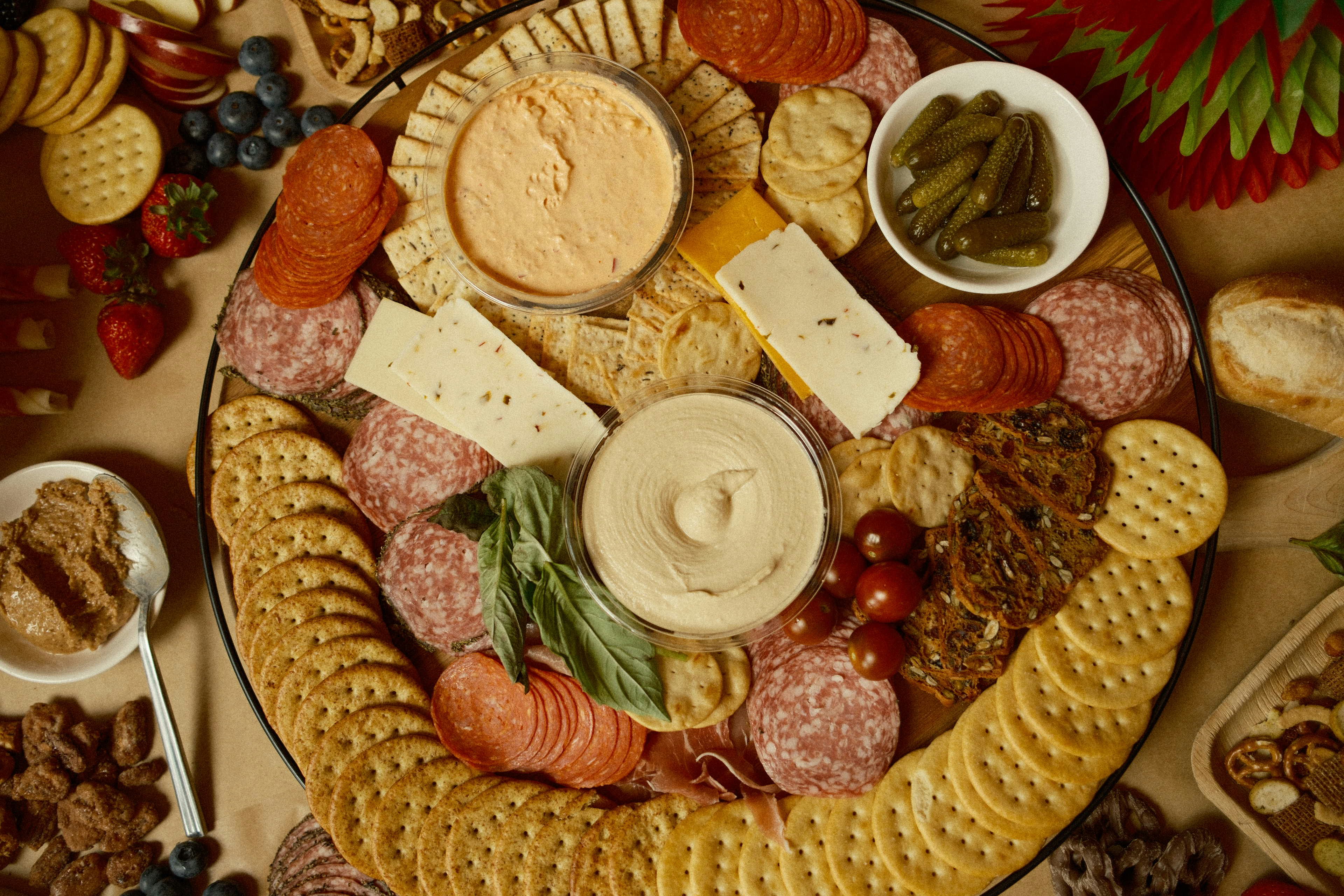 Charcuterie Carousel: A Mosaic of Cheese, Crackers, and Garnishes