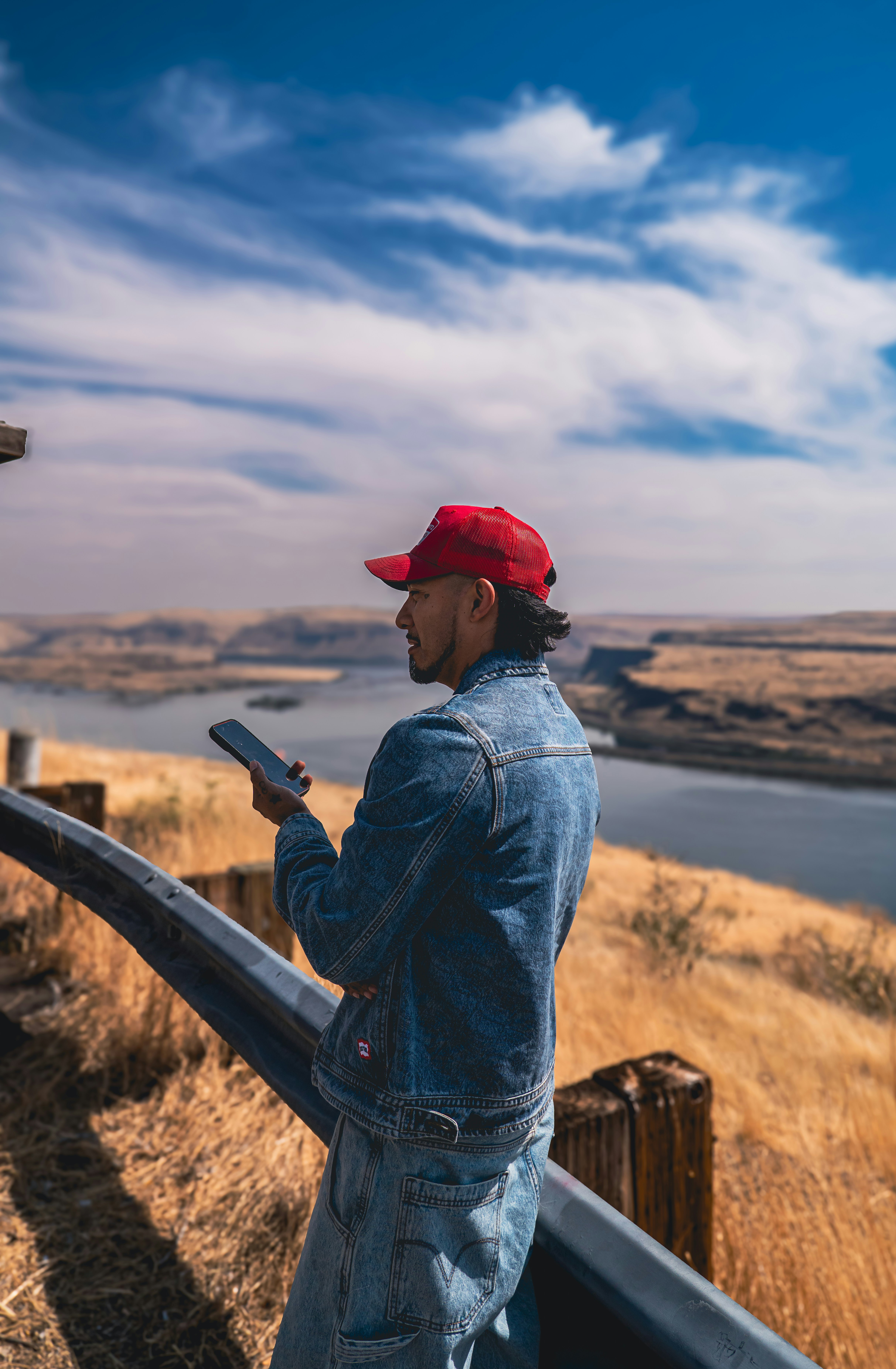 Red Cap, Quiet Horizon: A Portrait at the Canyon Rim
