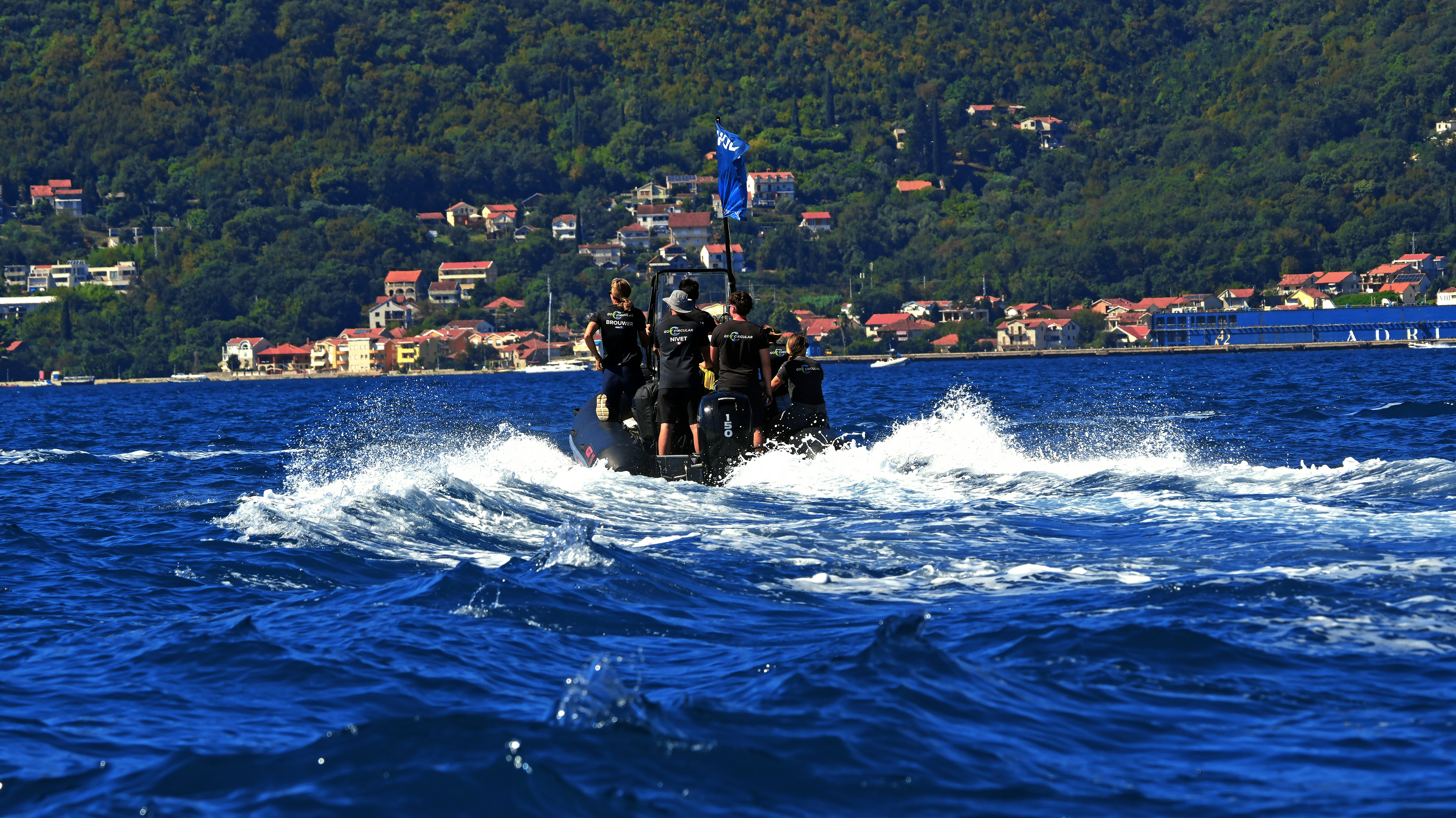 Rally of the Wake: A Jet-Boat Cresting the Sea