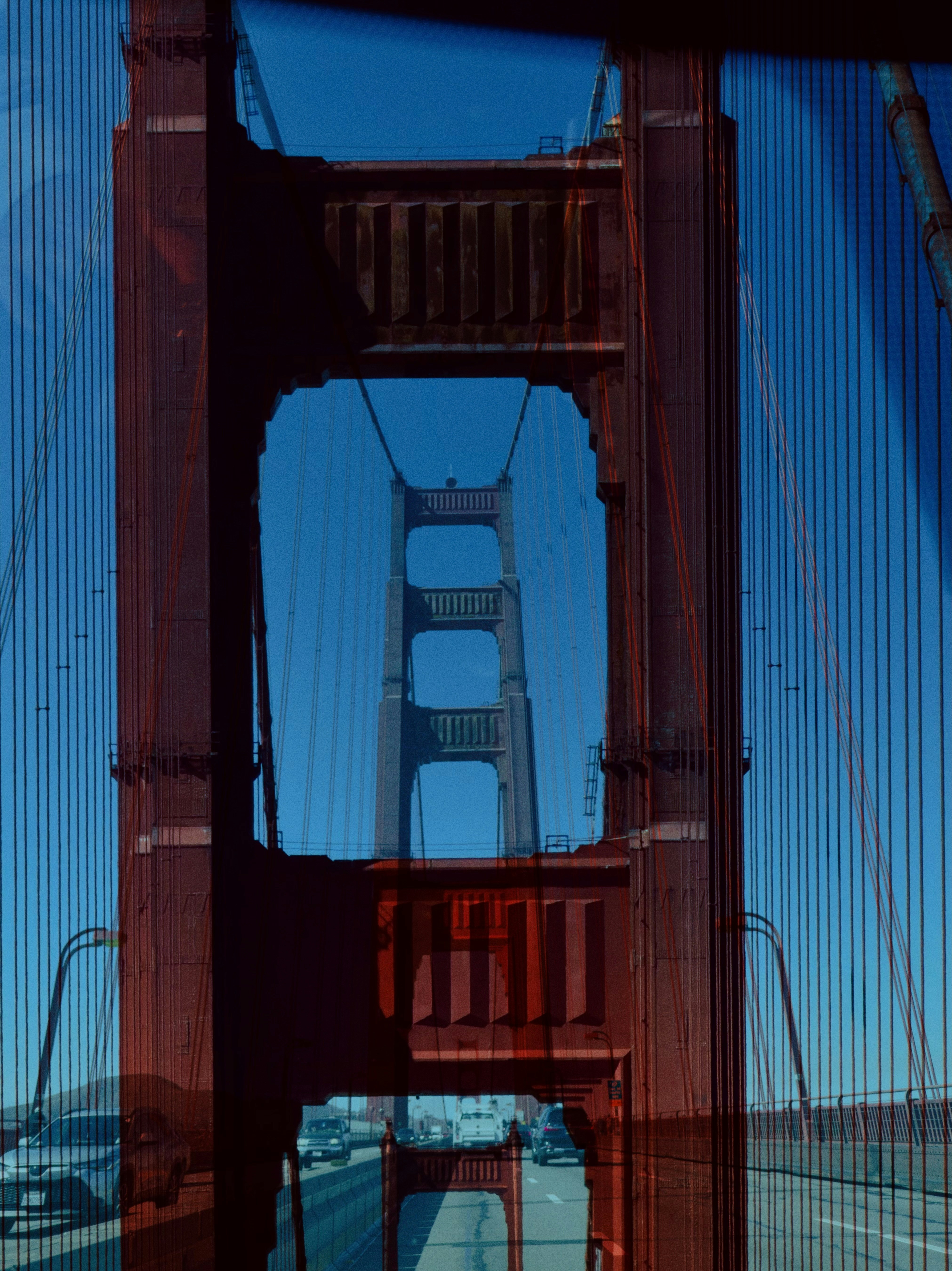 Vertical Echo: Towering Steel and Blue Sky