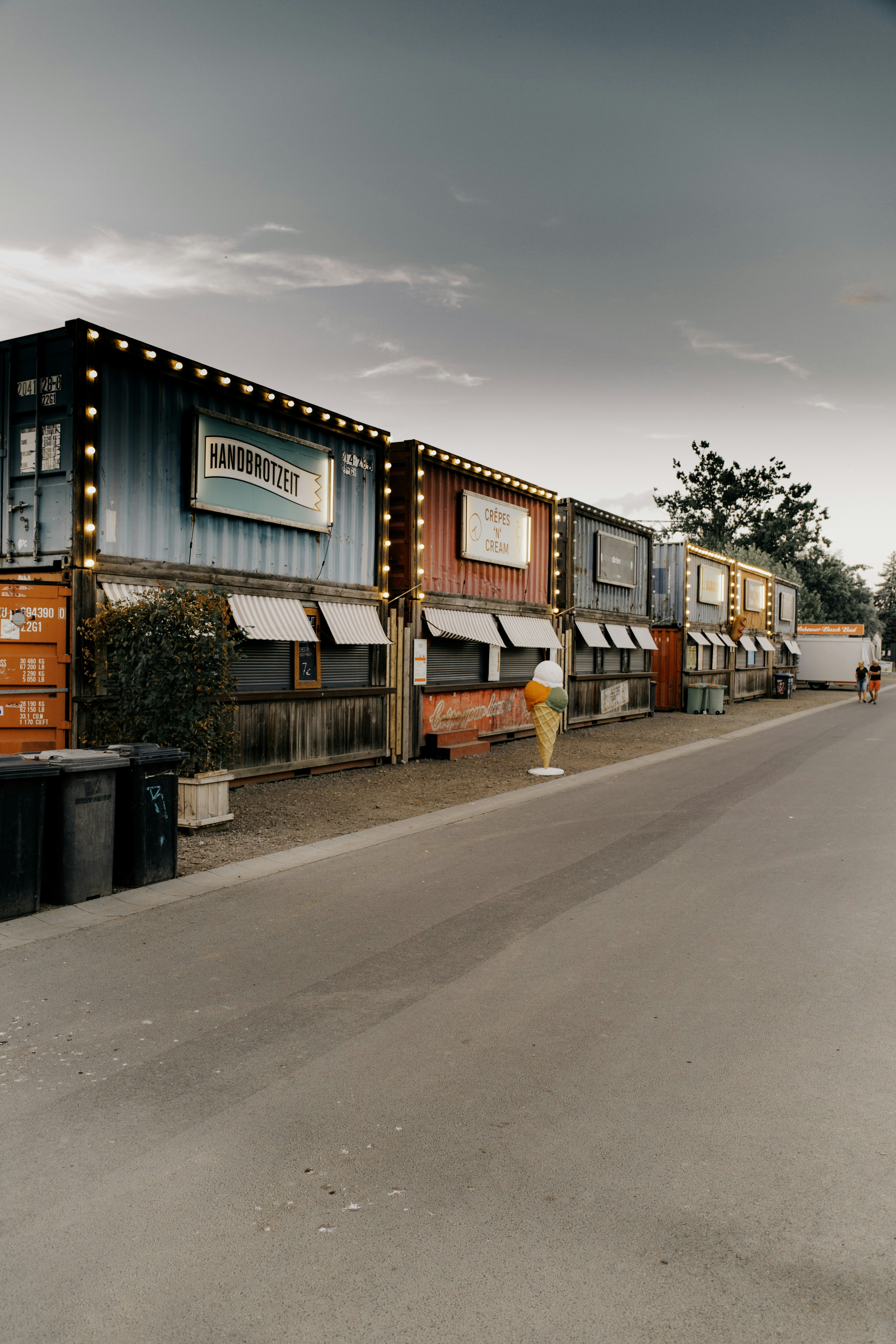 Colorful Shipping Containers Line the Quiet Street at Dusk