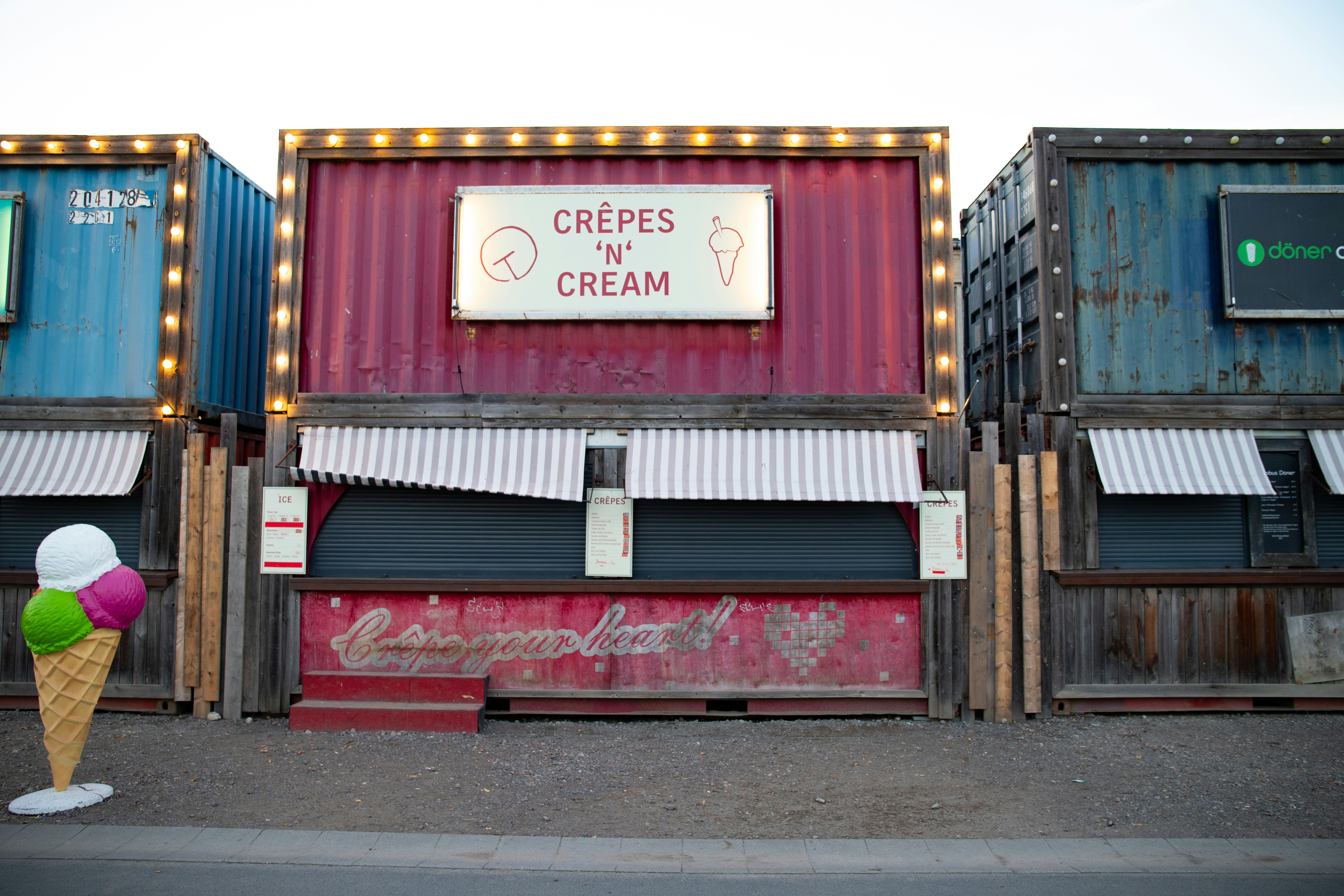Crêpe Stand Among Shipping-Container Facades