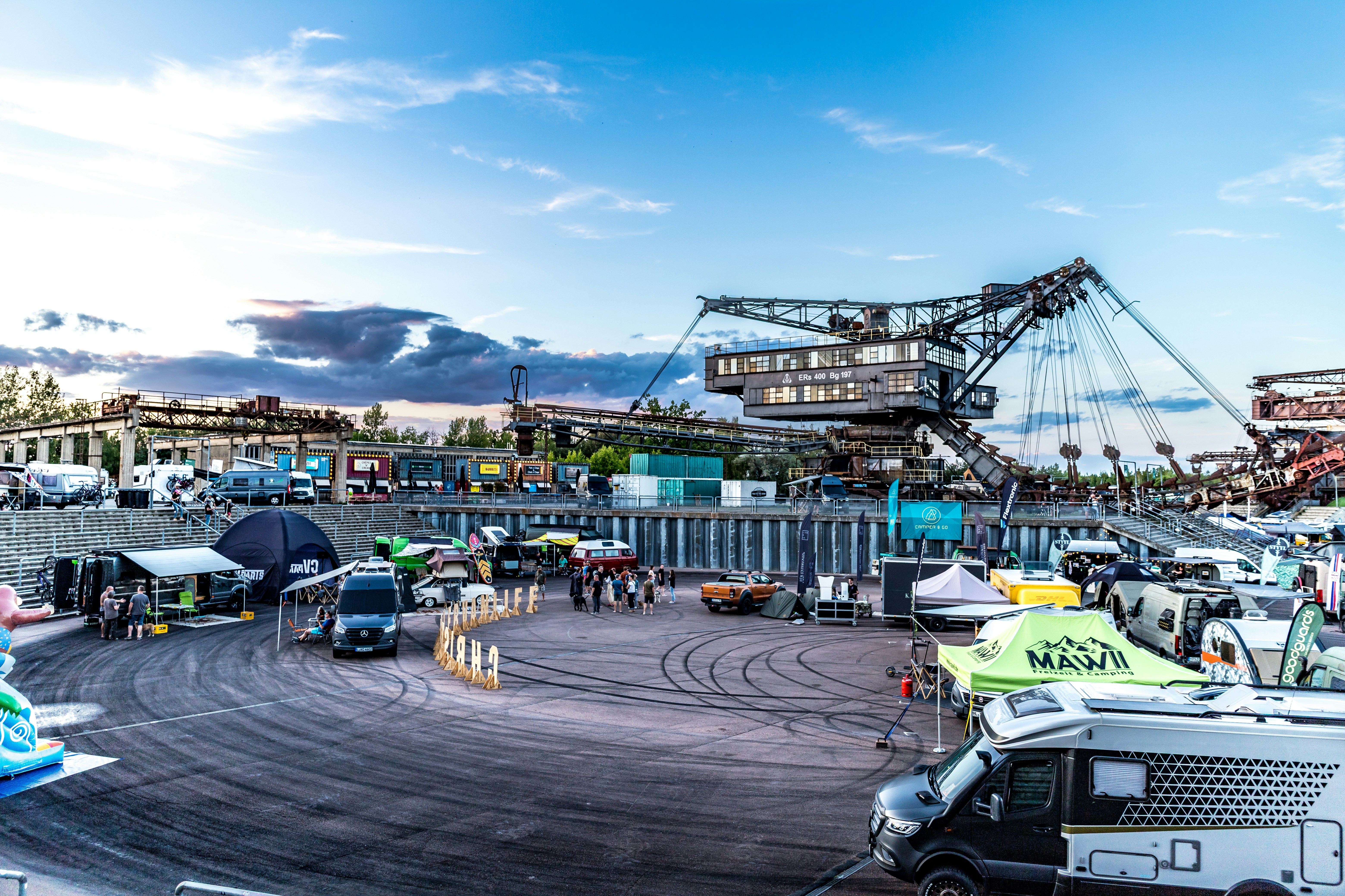 Circus of Machines: A Tire-Track Expo Under Blue Skies