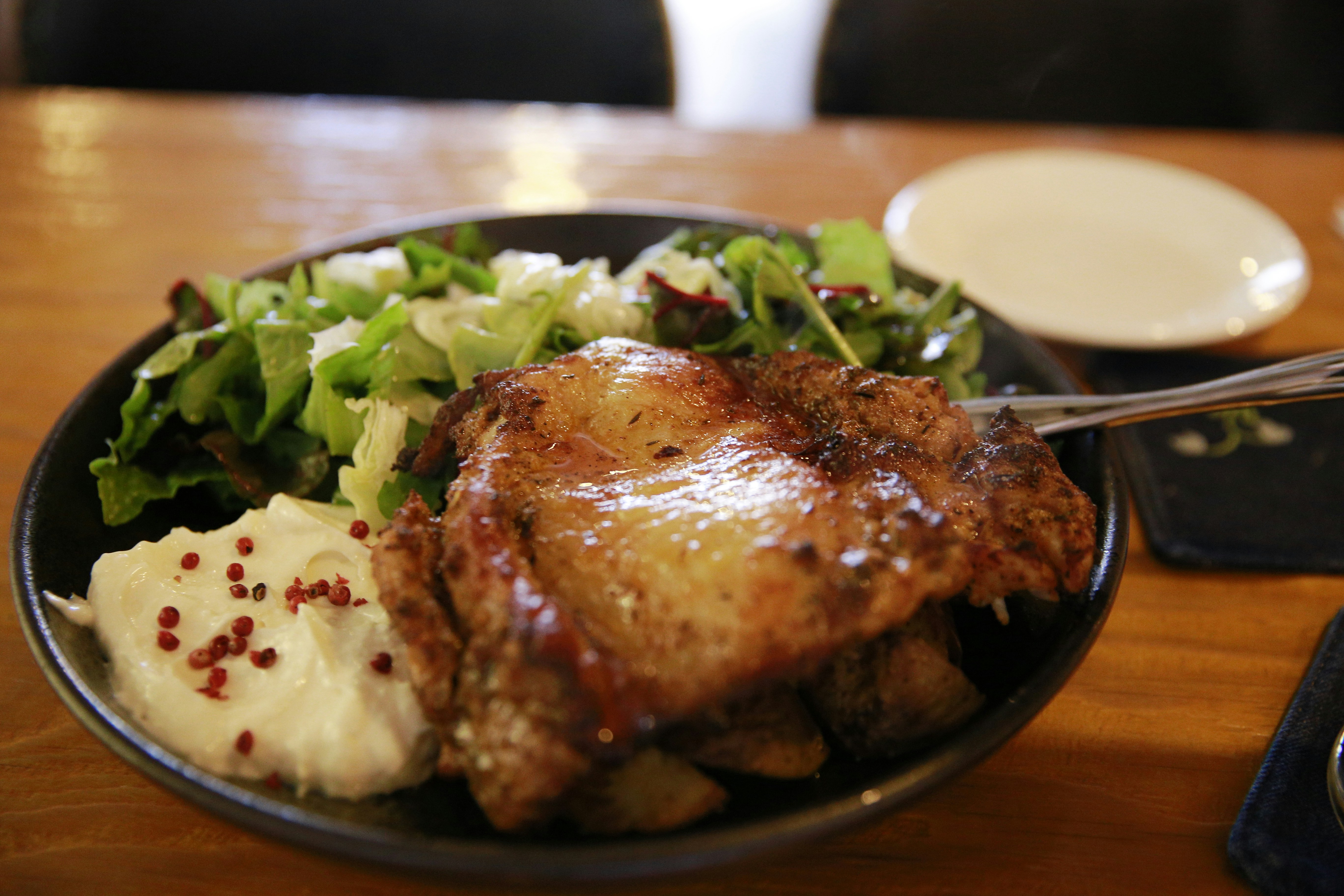 Charred Roast and Creamy Dip: A Hearty Plate with Greens