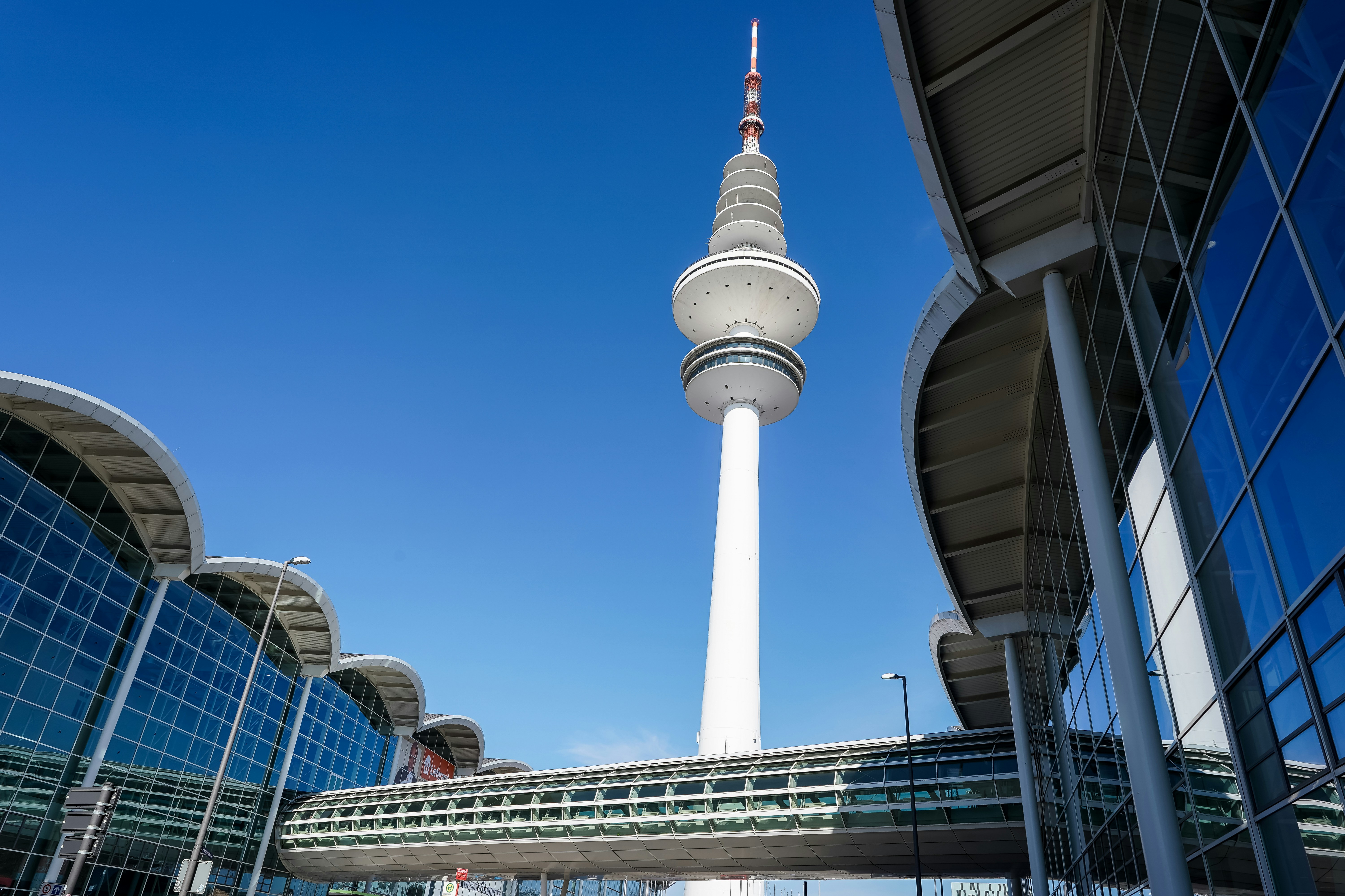 Towering Beacon Between Glass and Steel