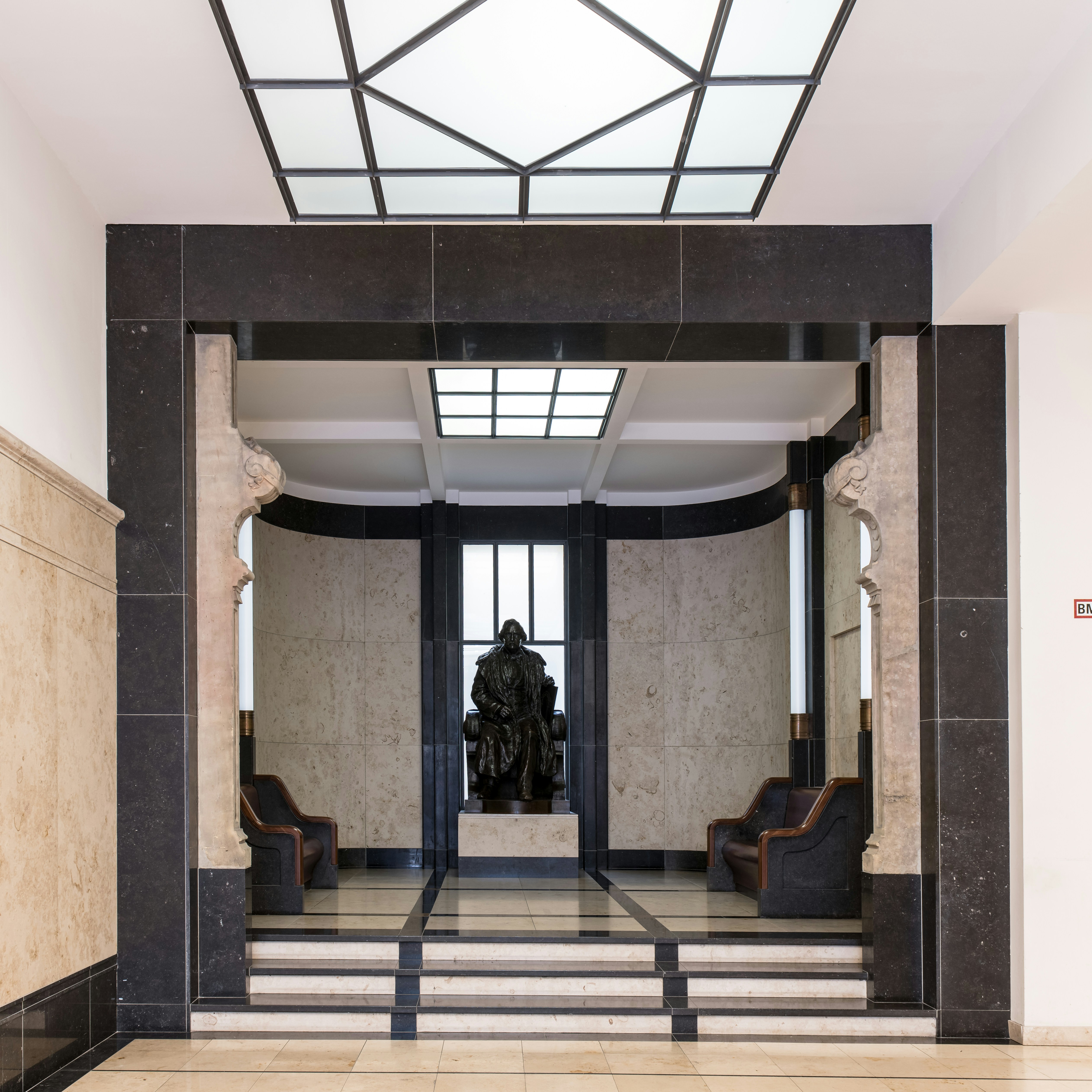 Symmetrical Hallway Framed by Monolithic Archways
