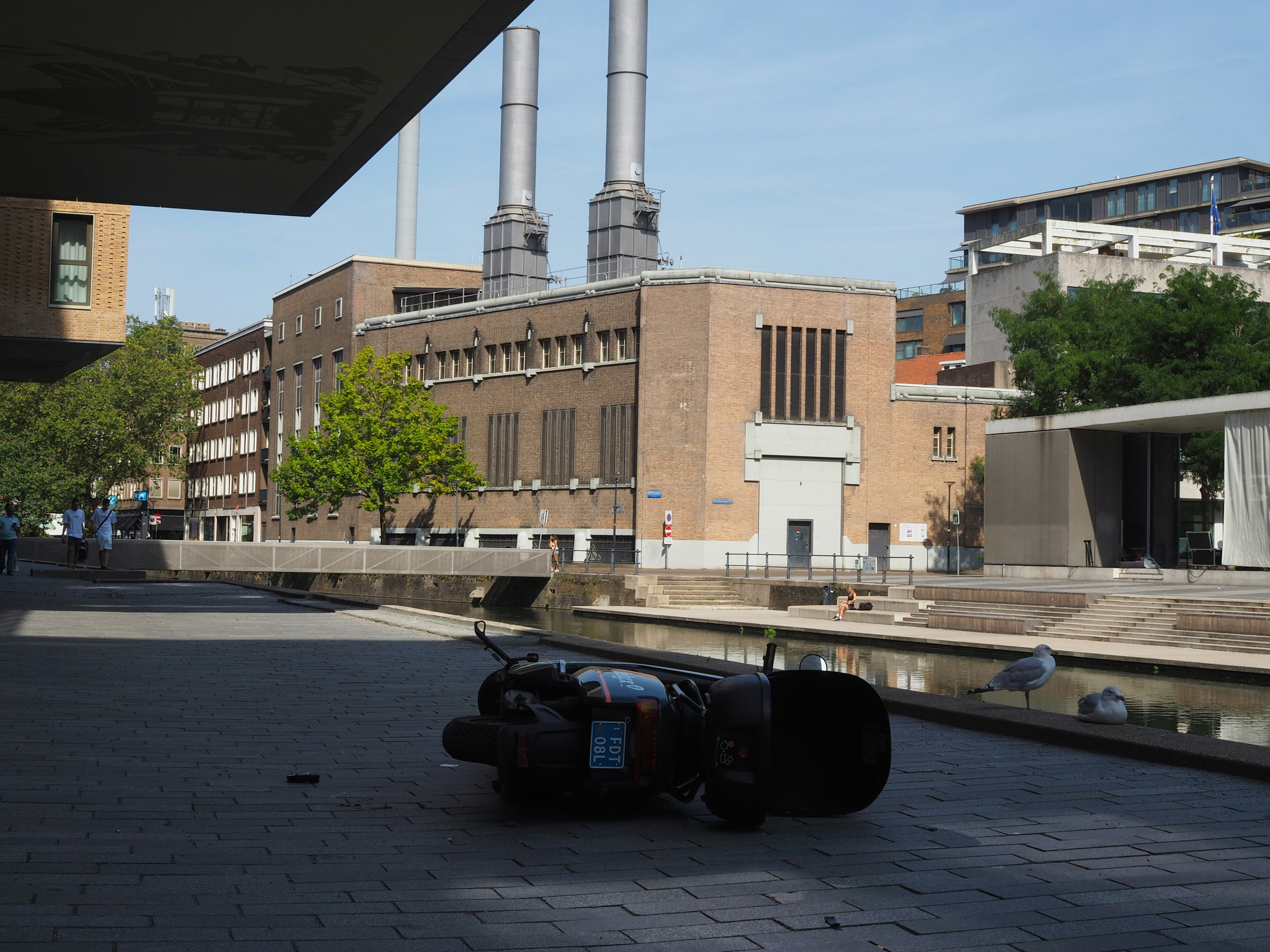 Rubble of the Quiet Street: A Fallen Scooter by Modern Bricks