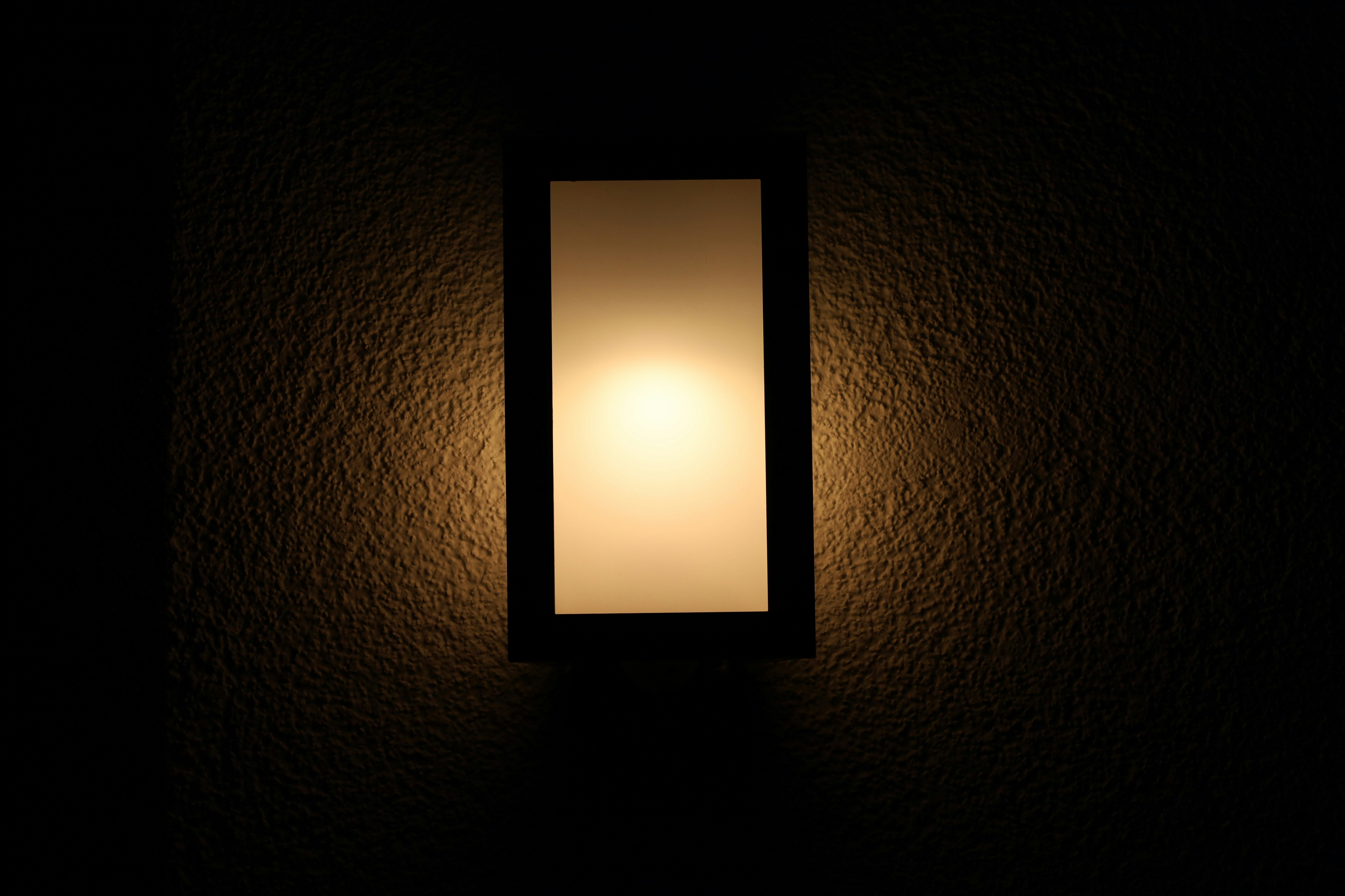 Midnight Glow: A Minimal Wall Lamp Portrait