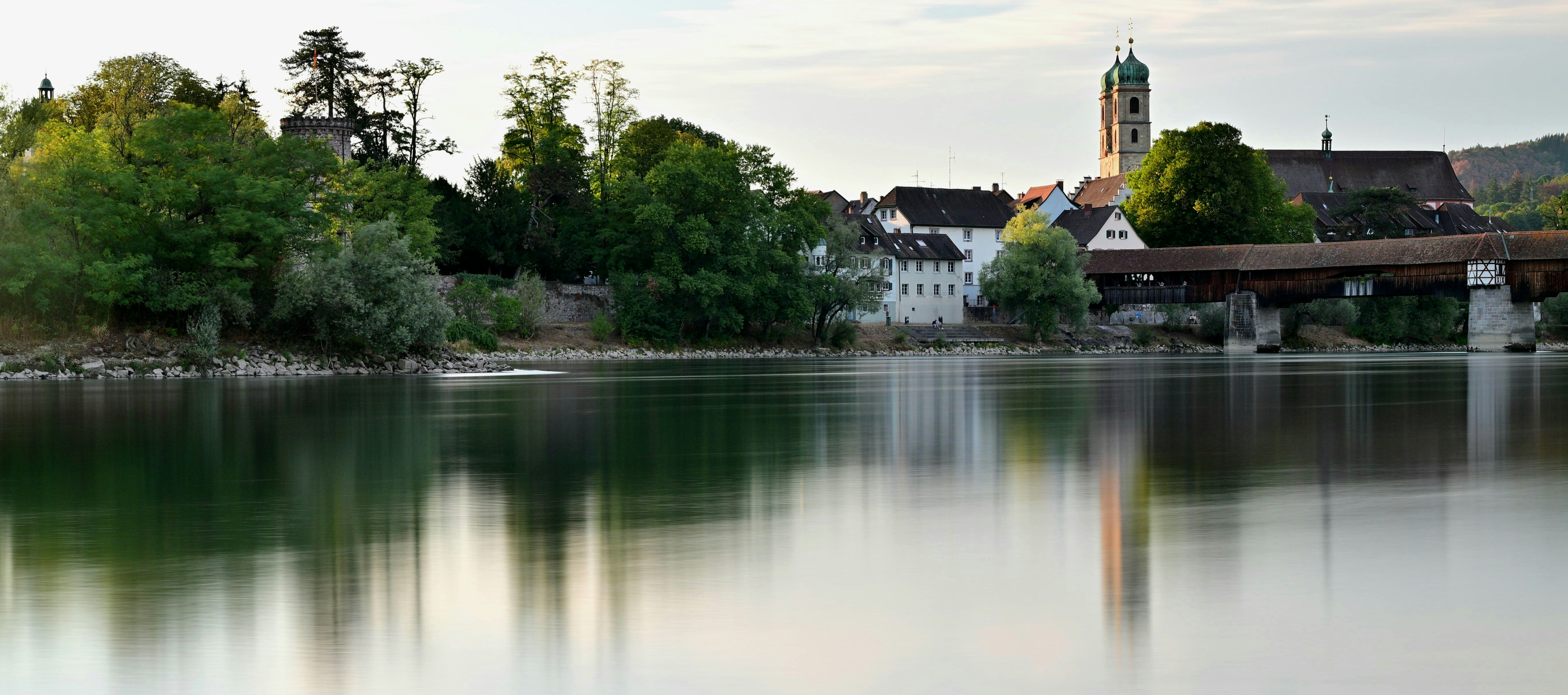Twin-arch Riverside: A Quiet Town Meanders Across the Still Water