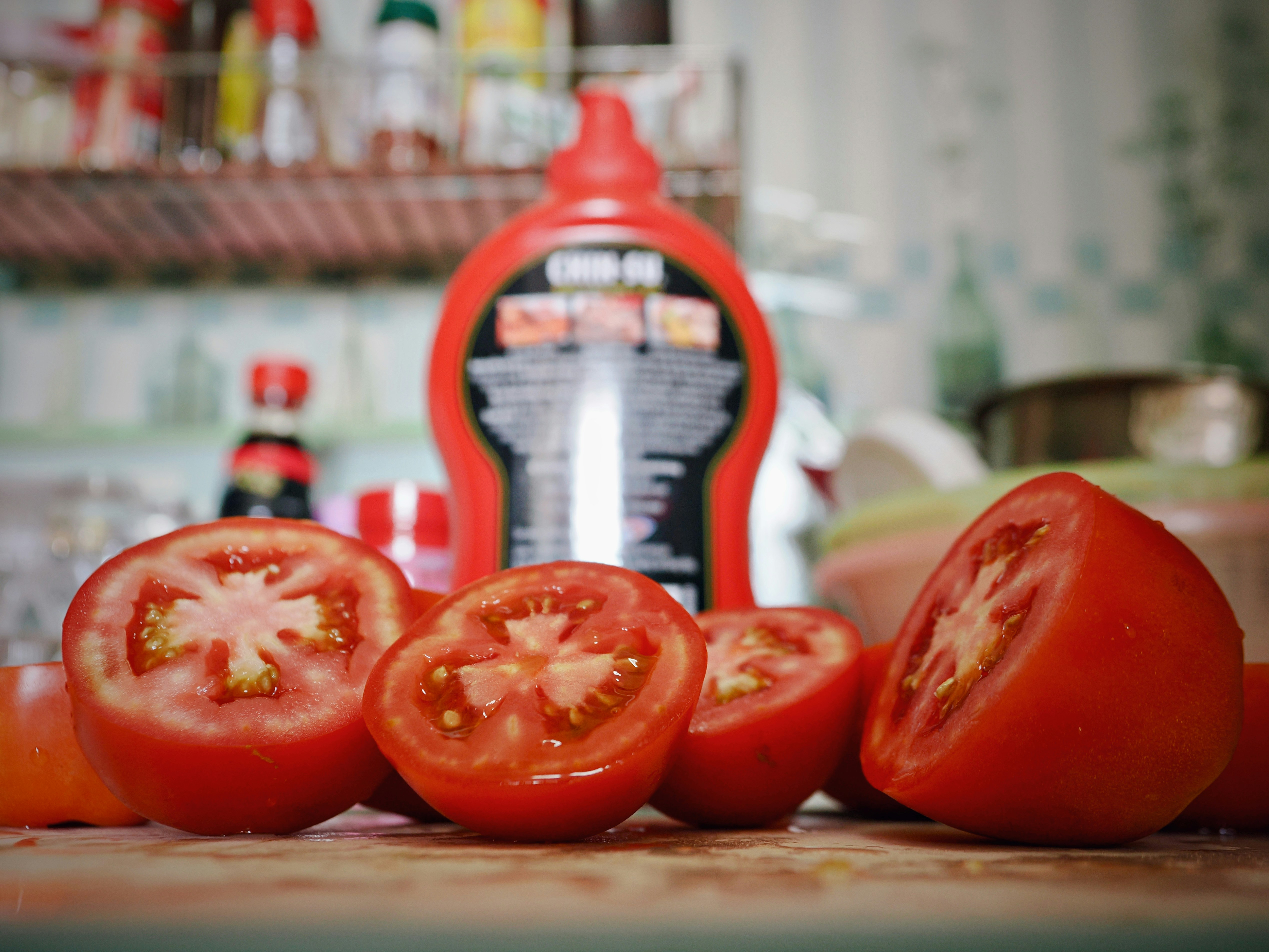 Tomato Spotlight: A Rustic Slice in Front of a Condiment Stall