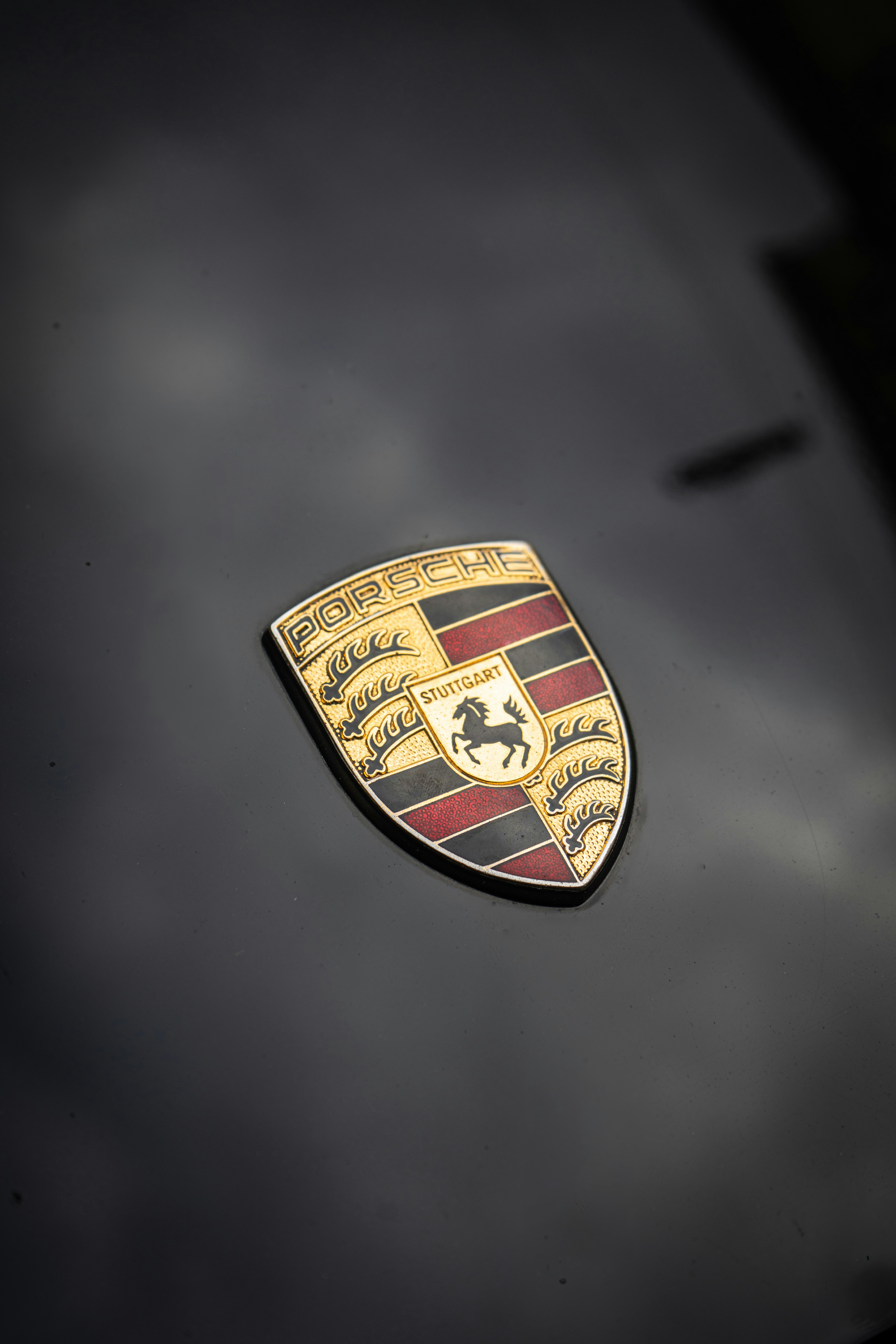 Porsche Emblem on a Dark Velvet Hood