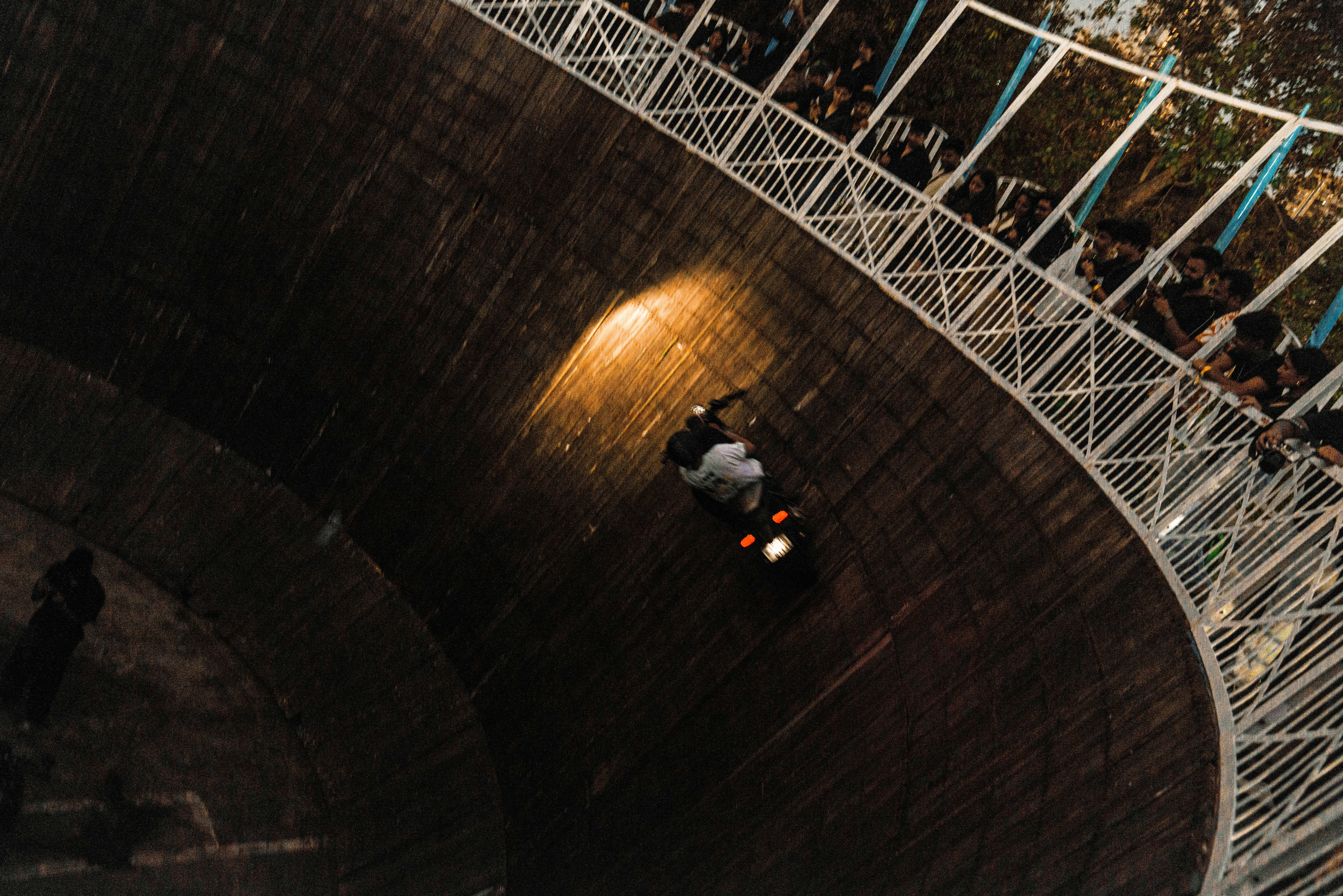 Motorcycle in the Circular Atrium: a Rooftop Dance of Light