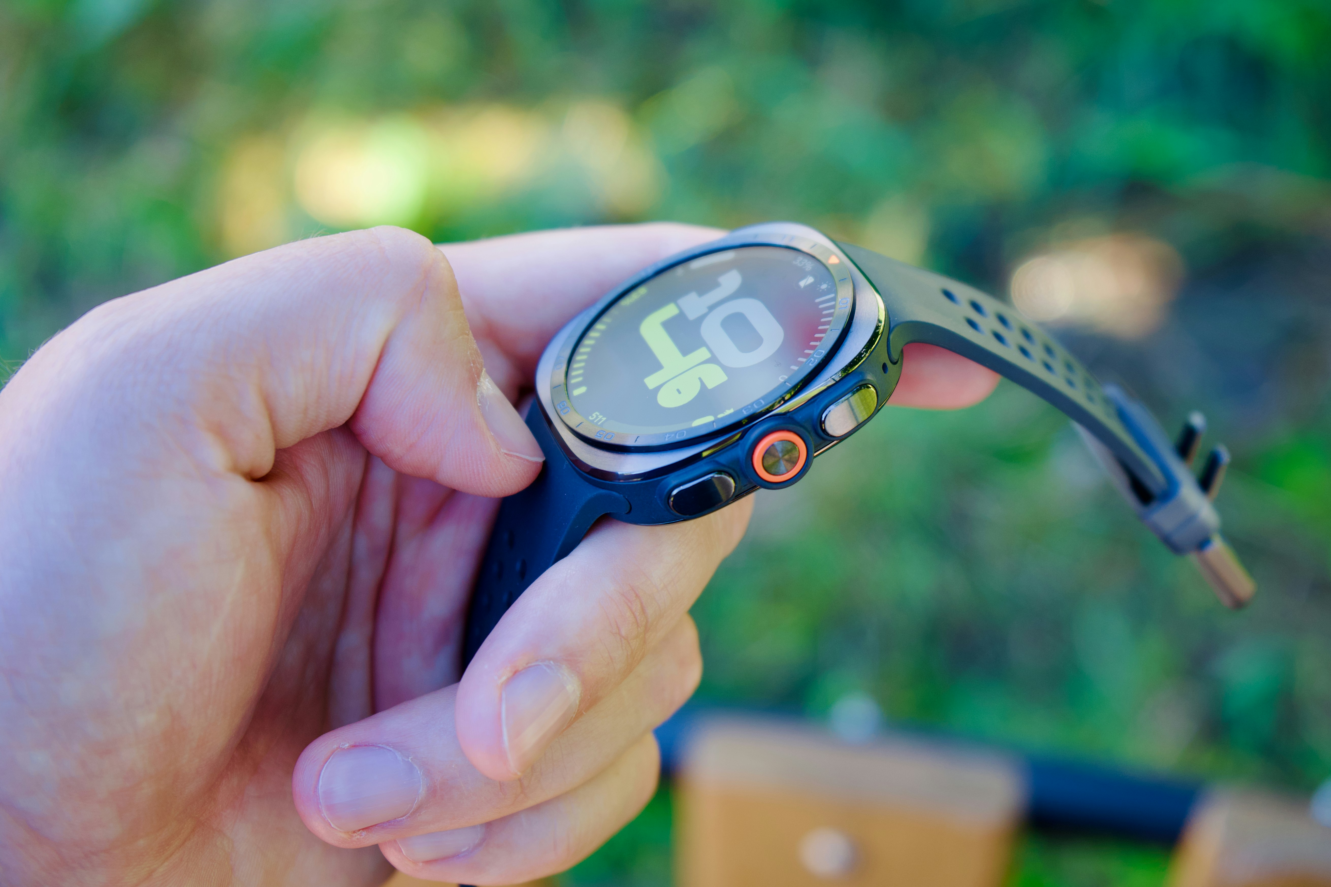 Holding a Timepiece: Close-Up of a Sporty Watch in Focus