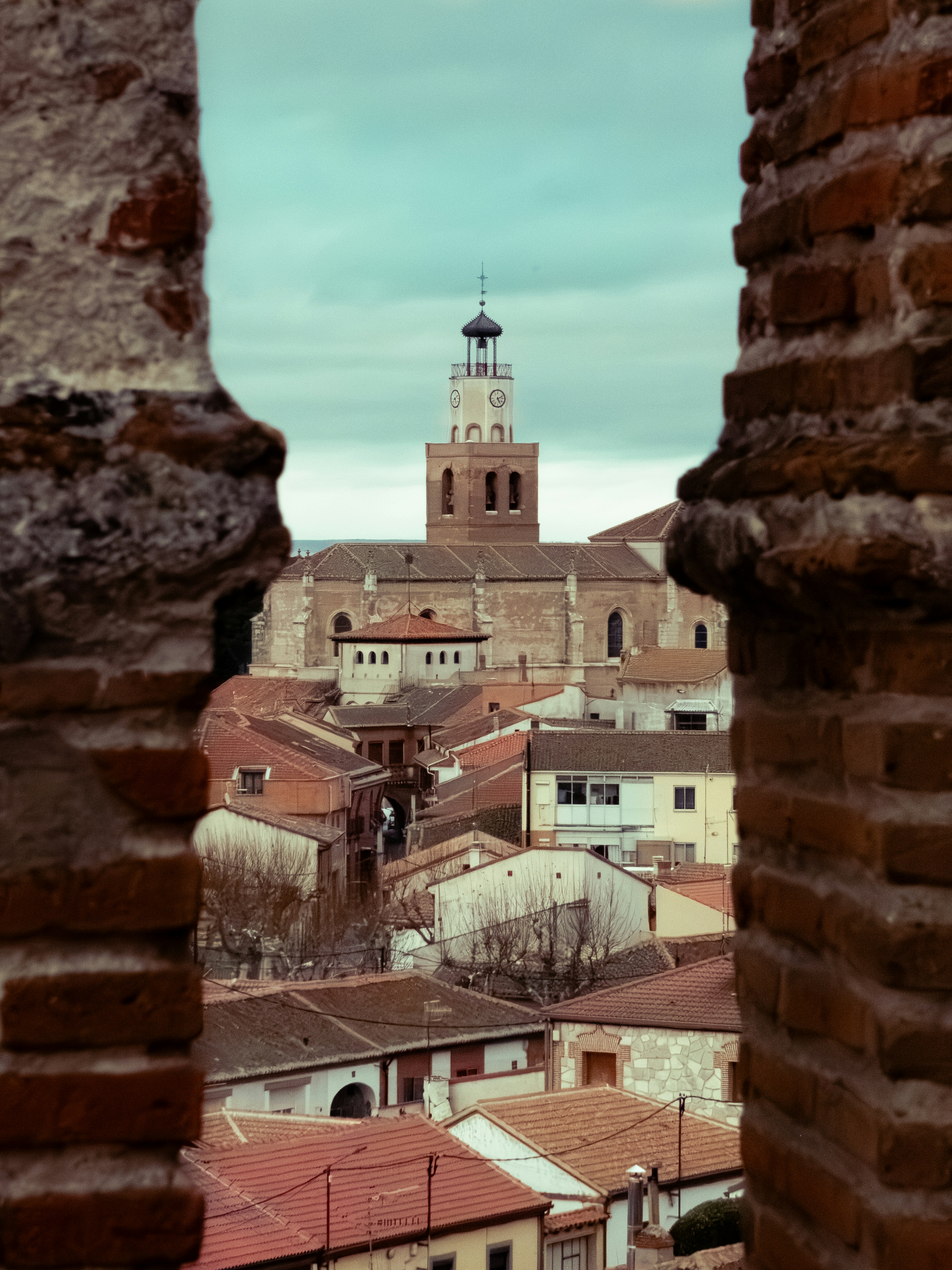 Hidden Bell Tower Over a Walled City