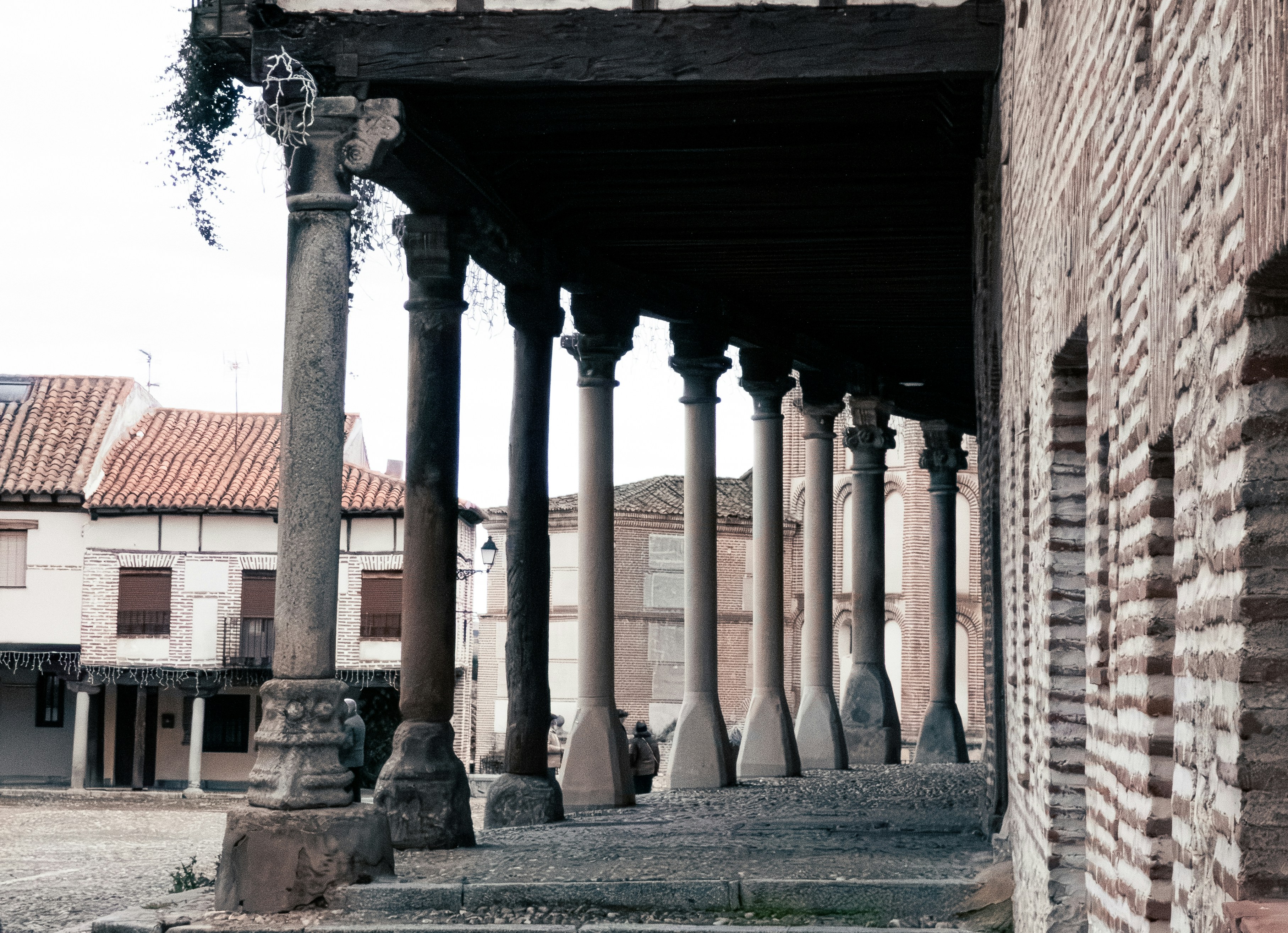 Colonnade of Quiet Steps: Echoes along the Brick Arcade