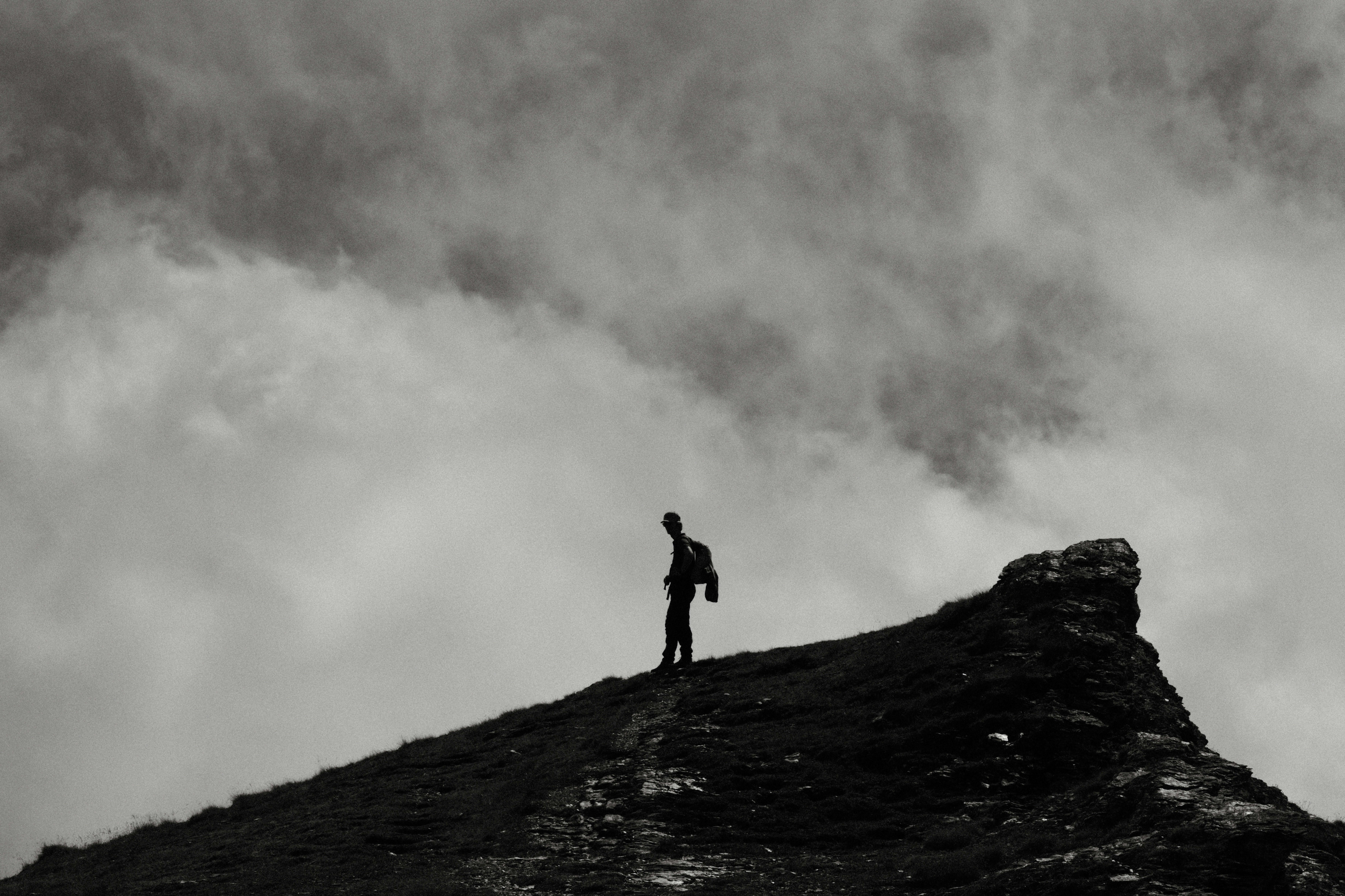 Alone at the Crest: A Lone Figure on a Windward Ridge