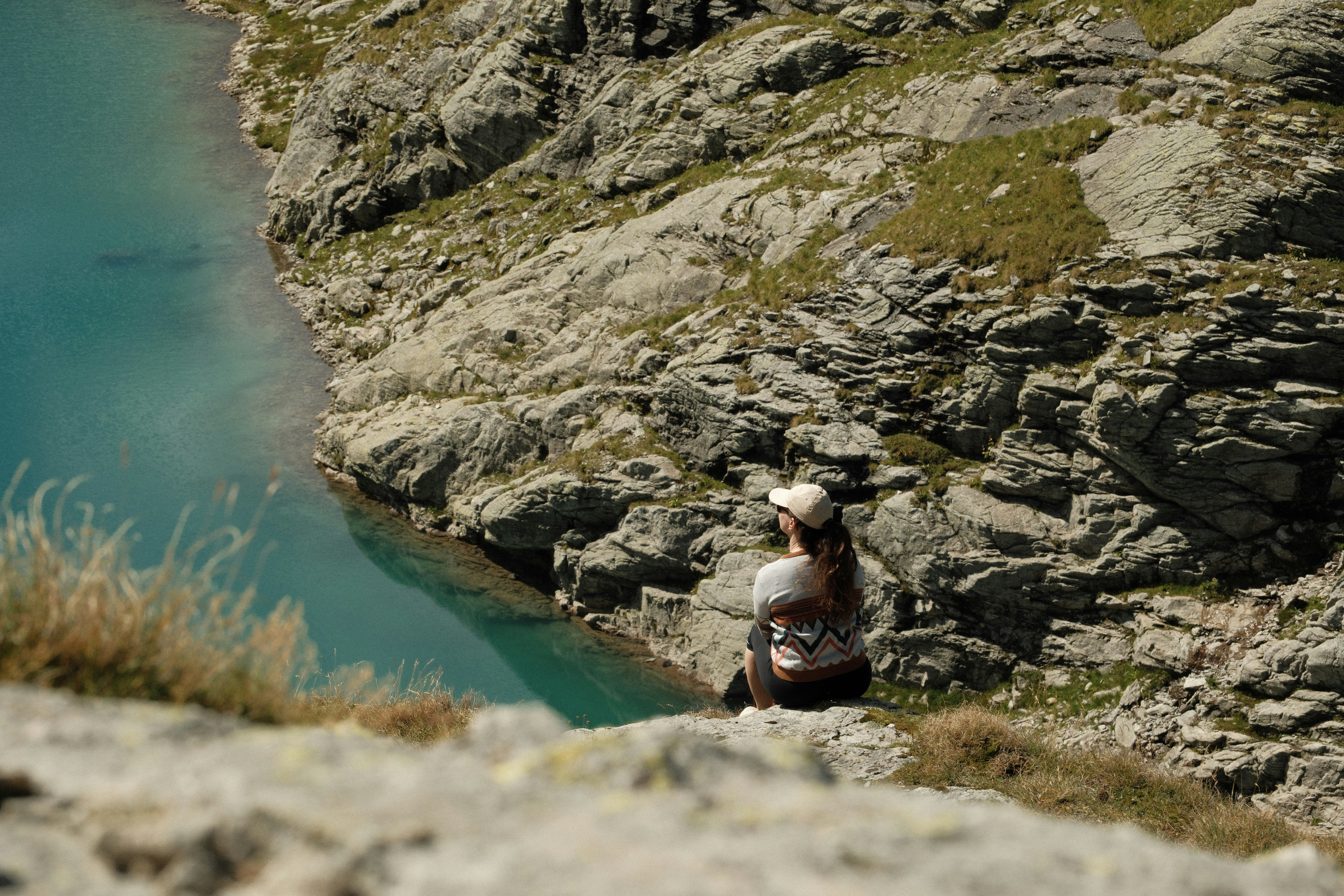 Cliffside Pause: A Moment by Turquoise Shore