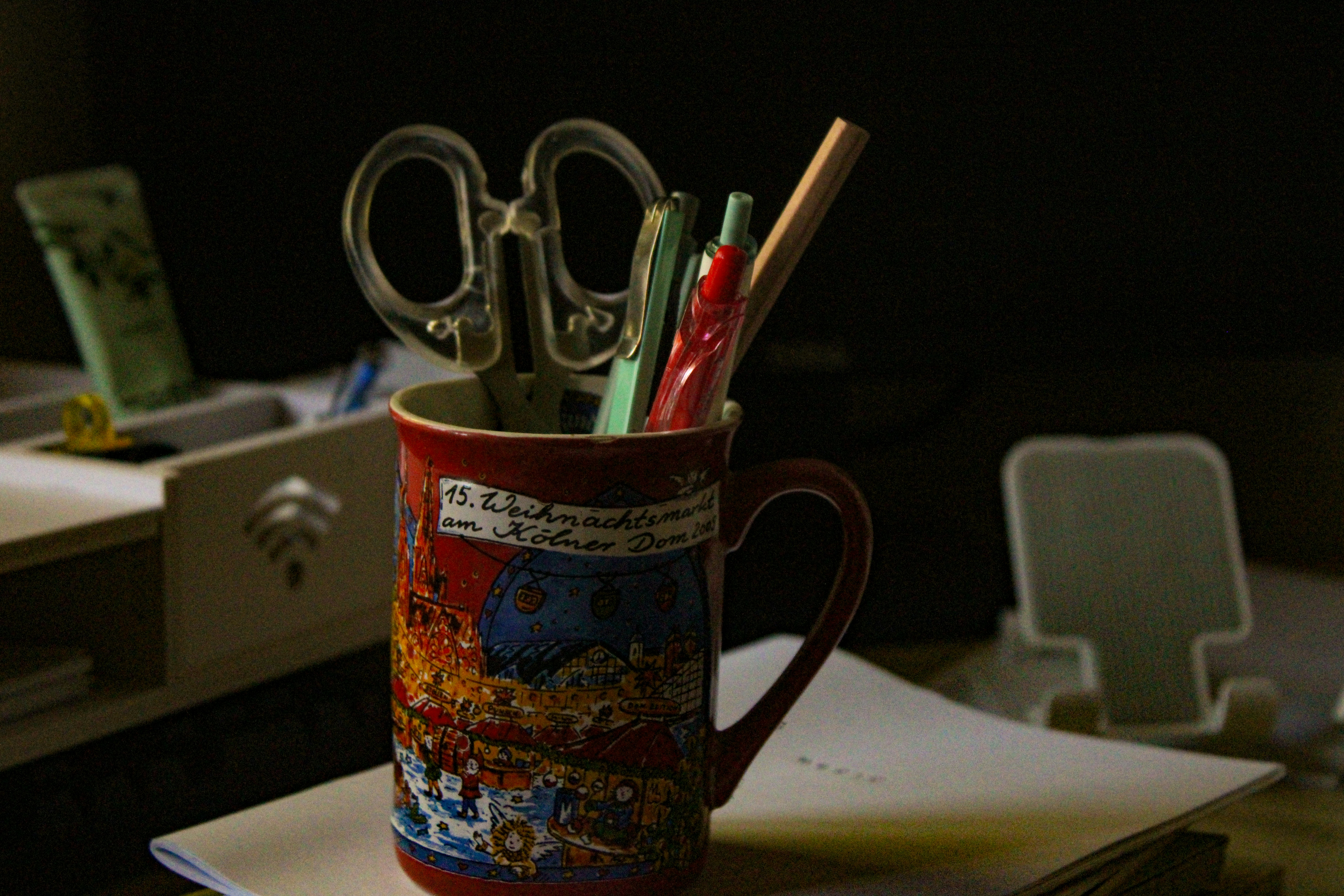 Ceramic Mug of Stationery Still Life Under Soft Office Lighting