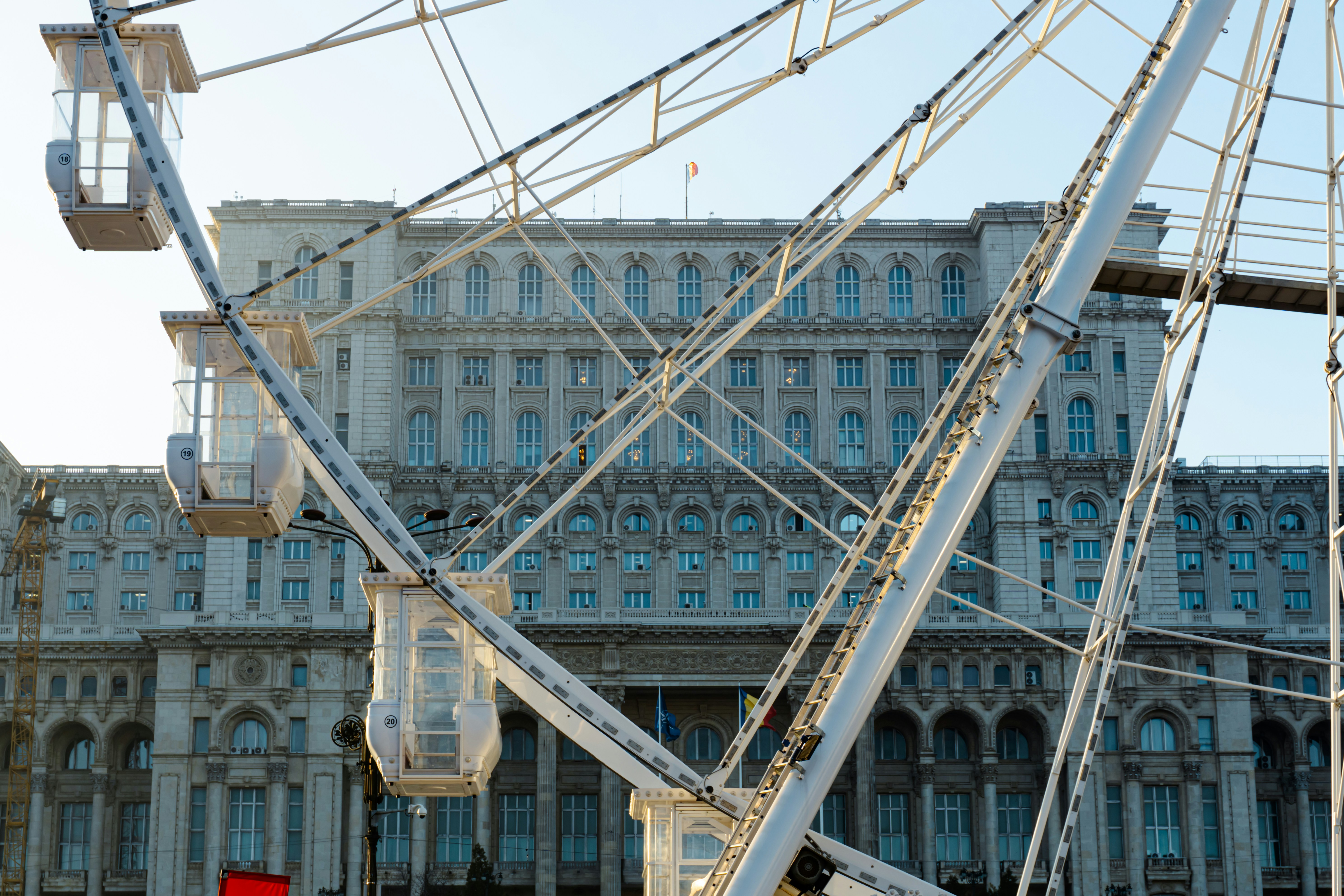 Urban Ferris Wheel Against Historic Facade