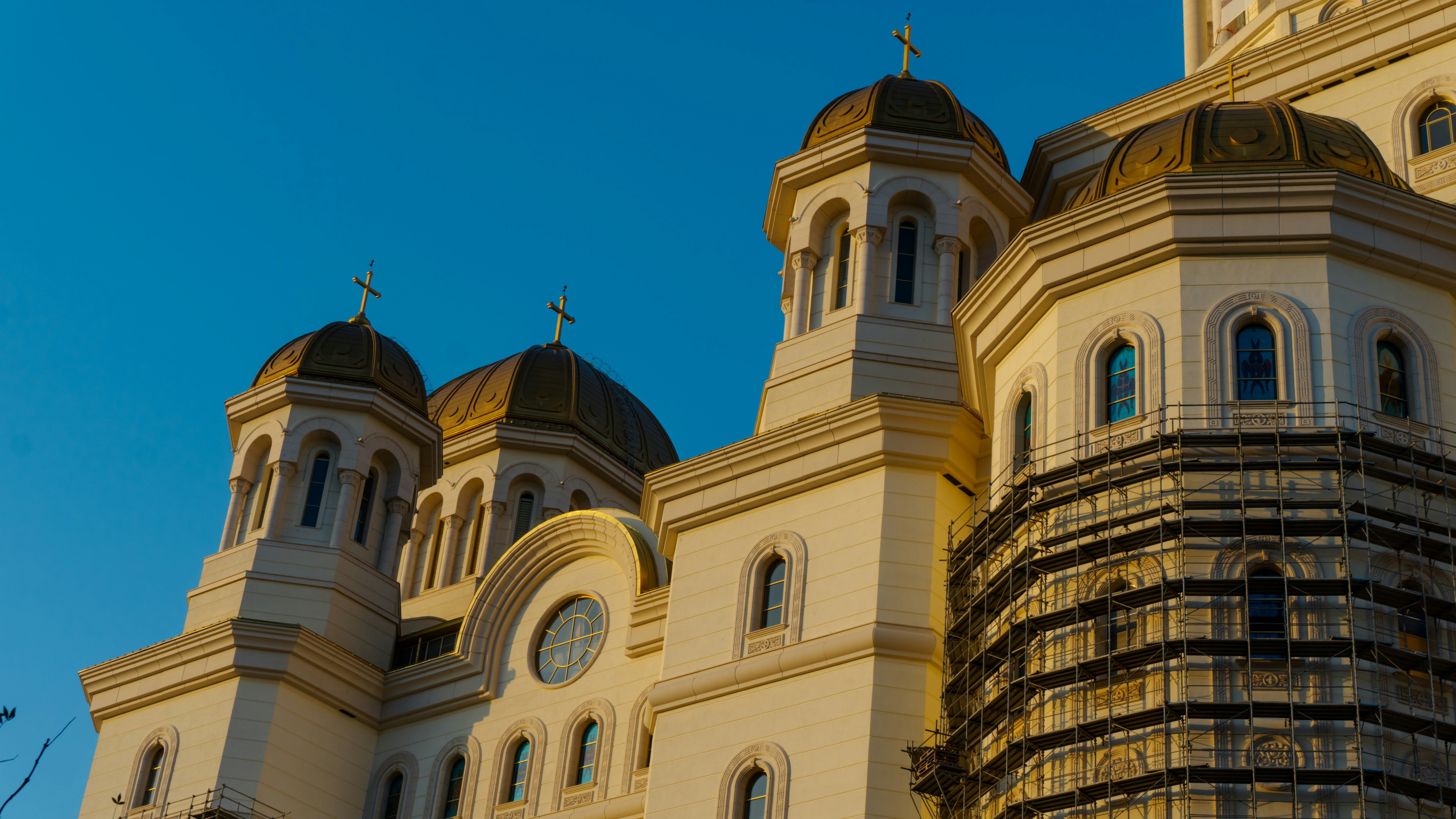 Cathedral in the Sun: Towers and Scaffolding Dressed in Light