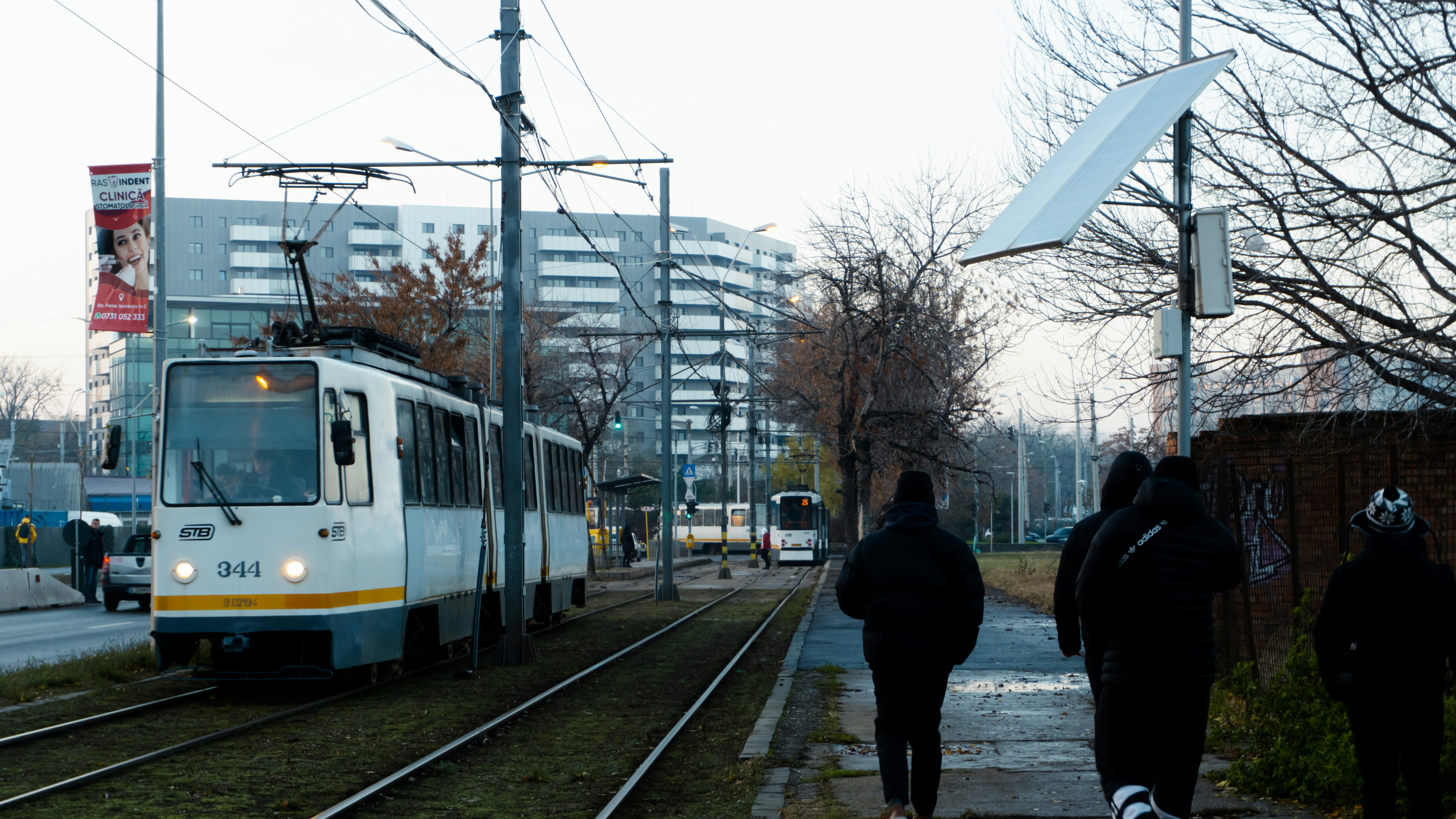 Tracks Leading Toward the City: A Tranquil Tram Stop Morning