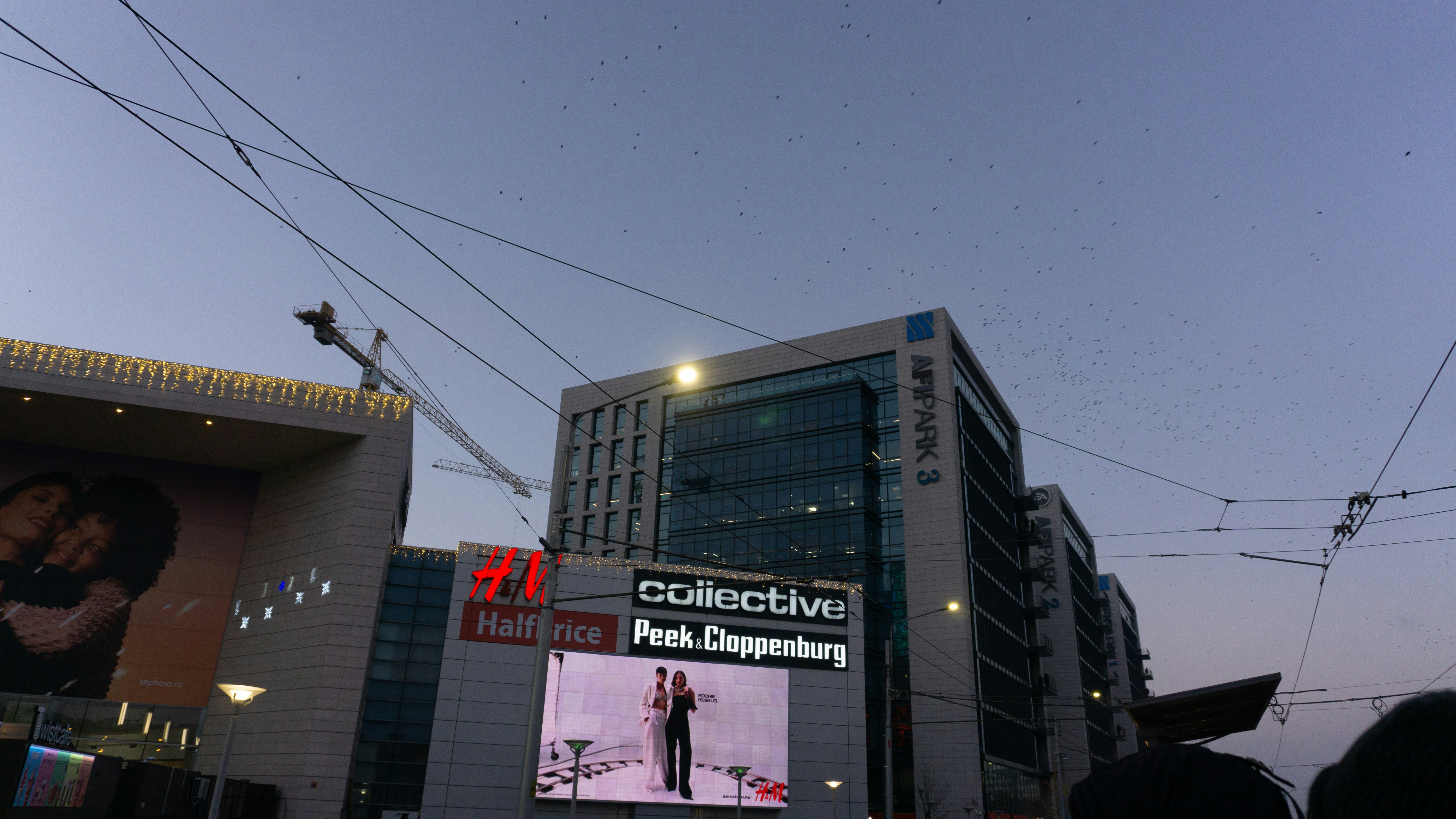Neon Facades and Night Busyness at a City Center