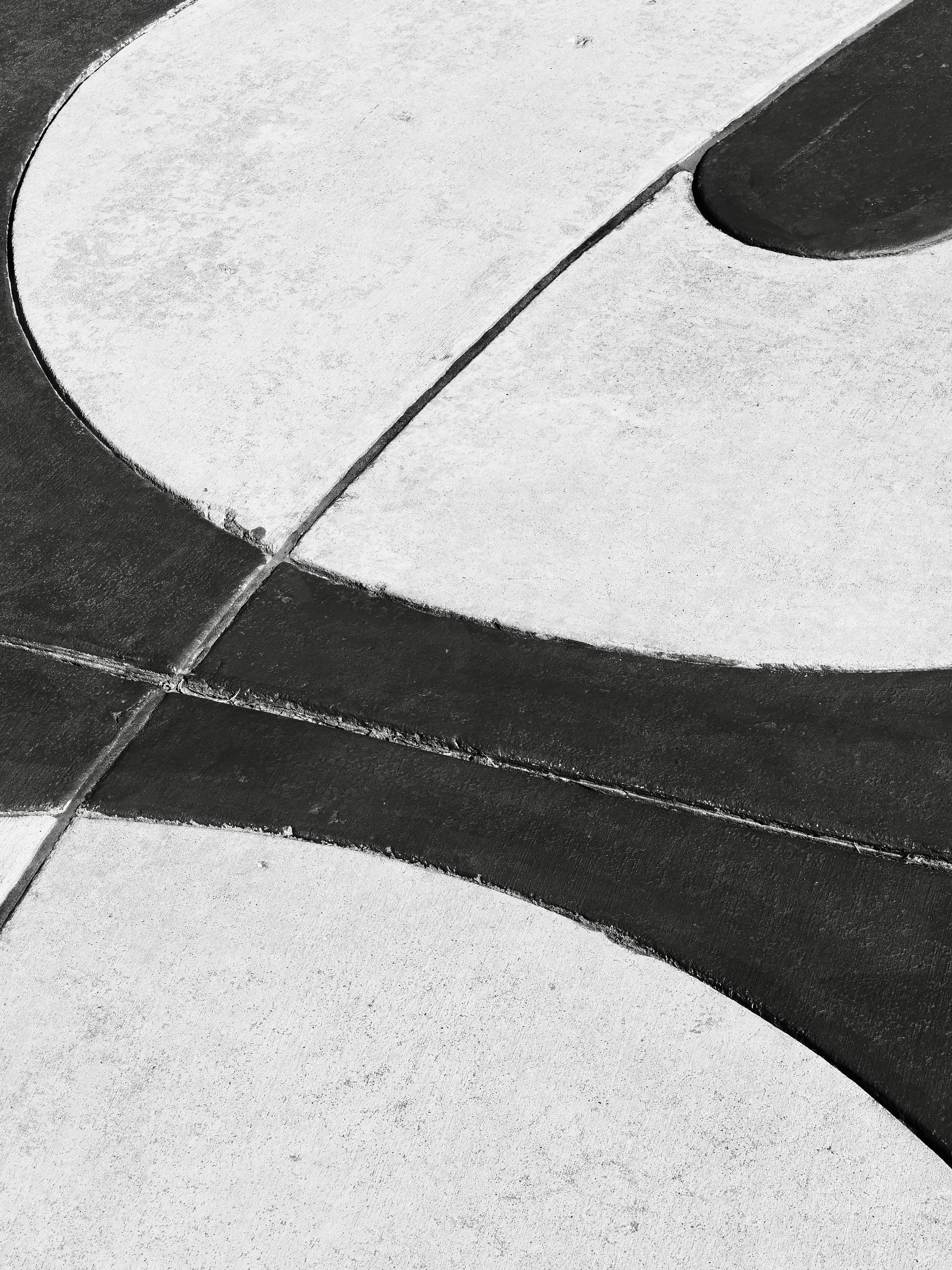 Converging Curves: A Monochrome Abstract in Concrete