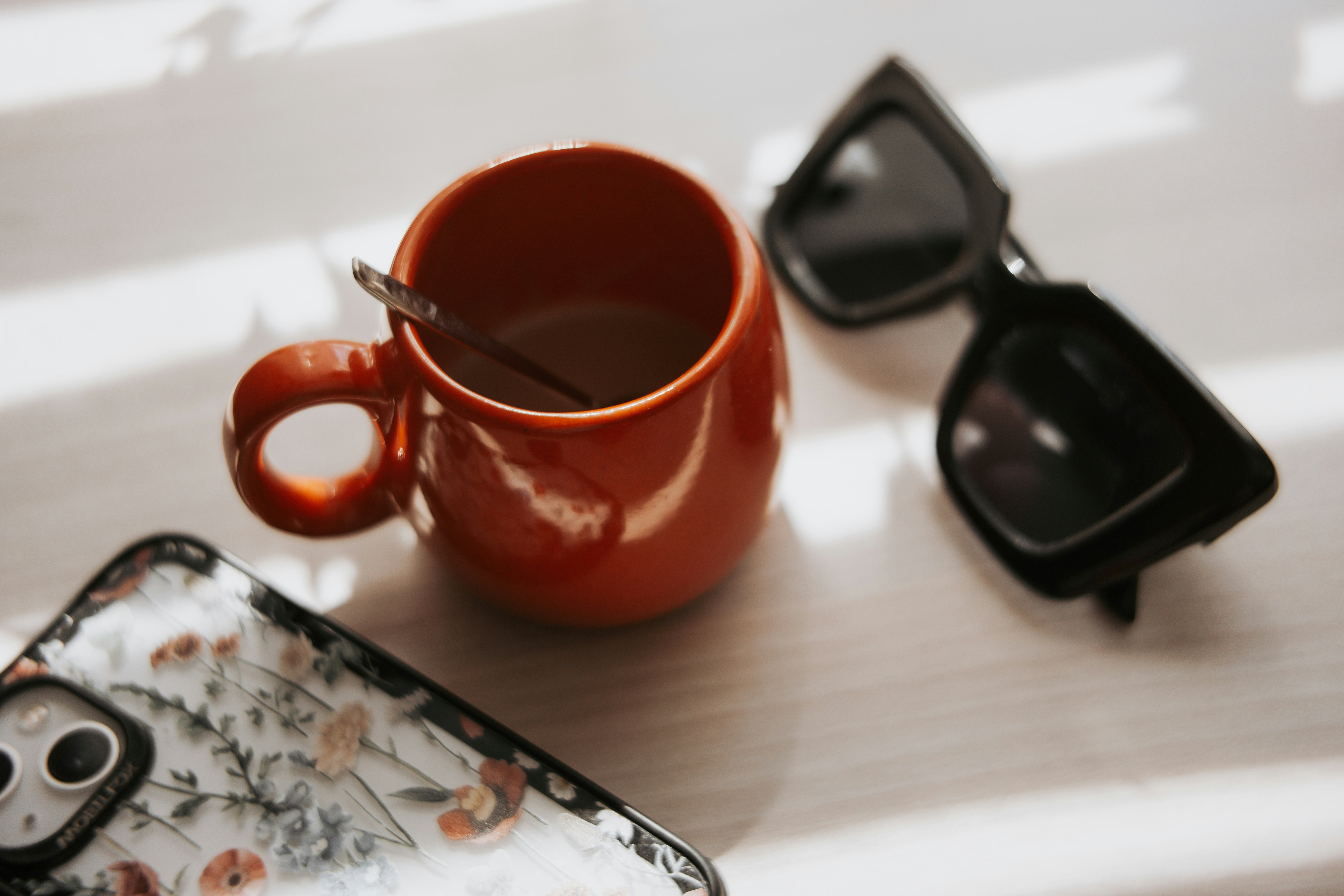 Midmorning Calm: A Coffee Moment with Tech and Tea