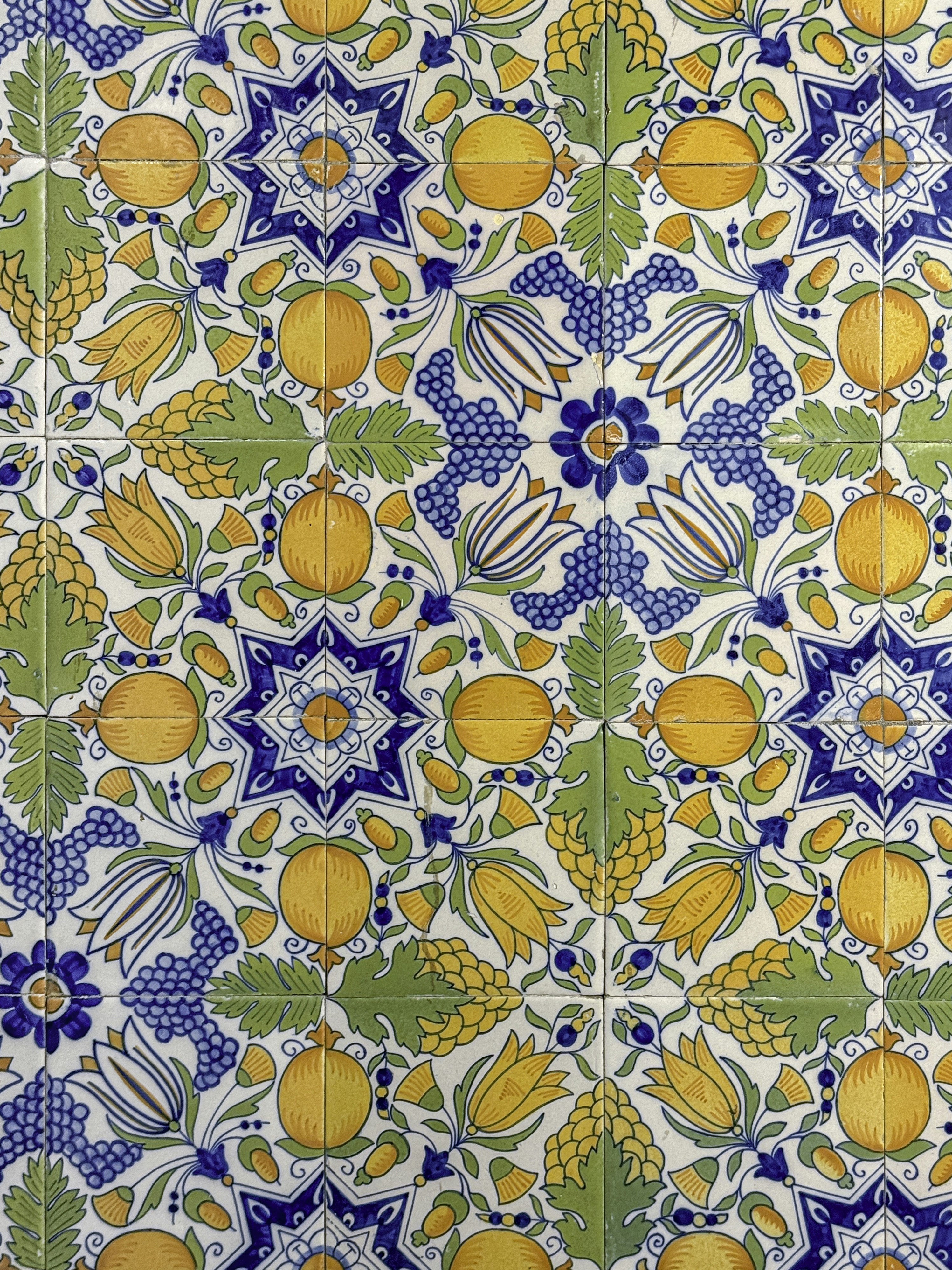 Ornamental Tile Tapestry: Starbursts and Gourds in Blue-Orange Green