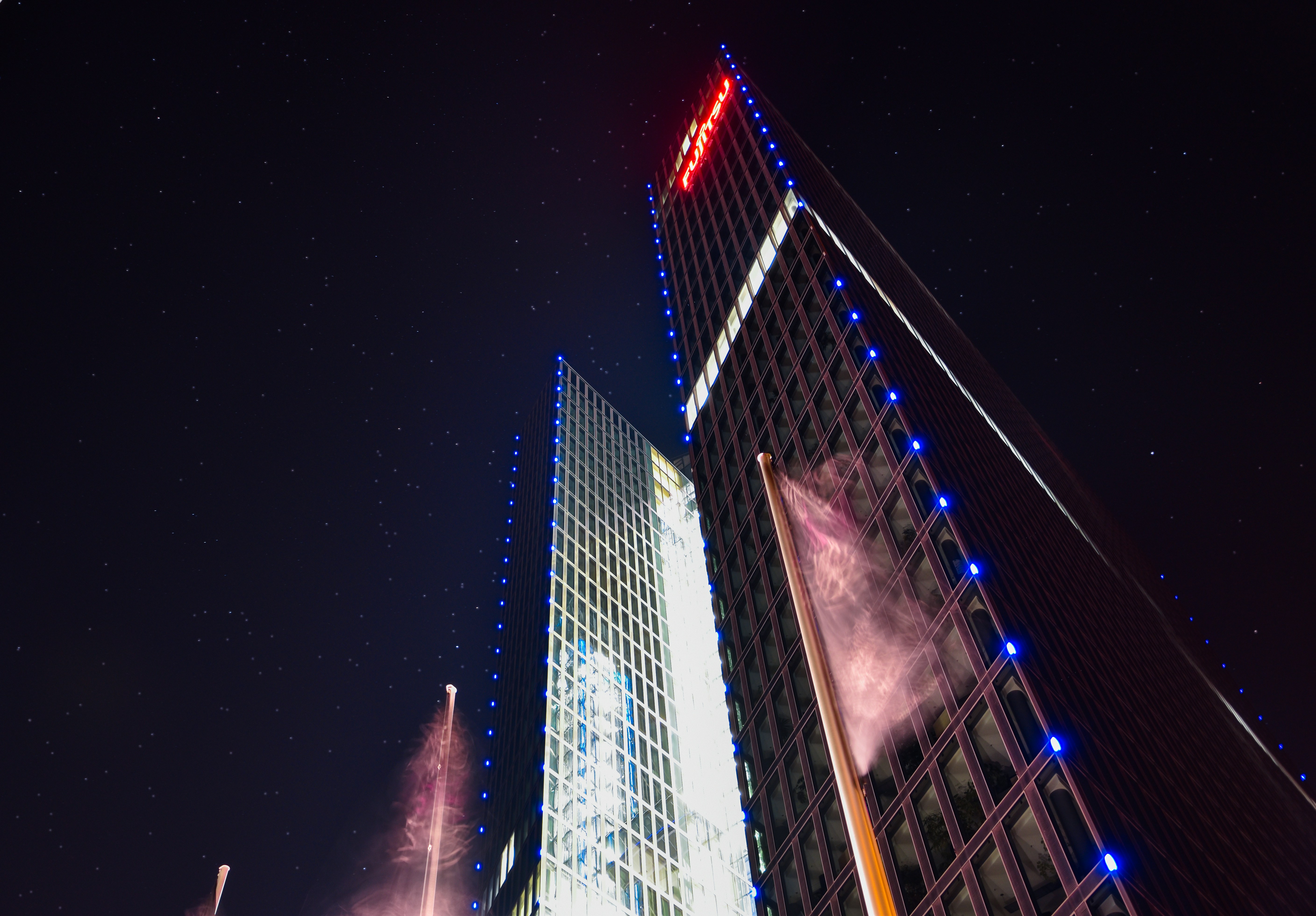Neon Peaks: Nightbound Skyscrapers Reaching for Starry Sky