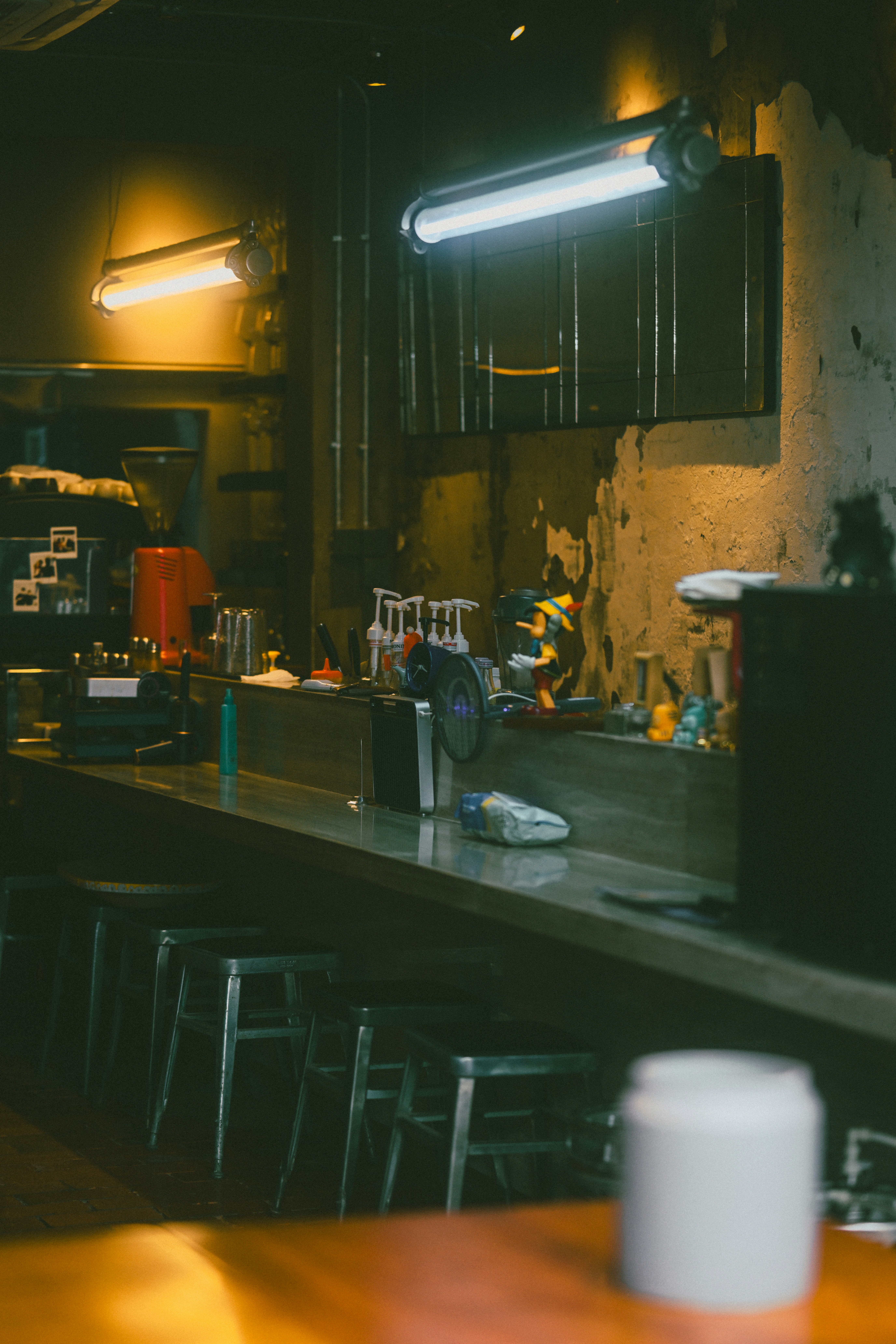 Neon-lit Bar Counter in a Quiet Workshop