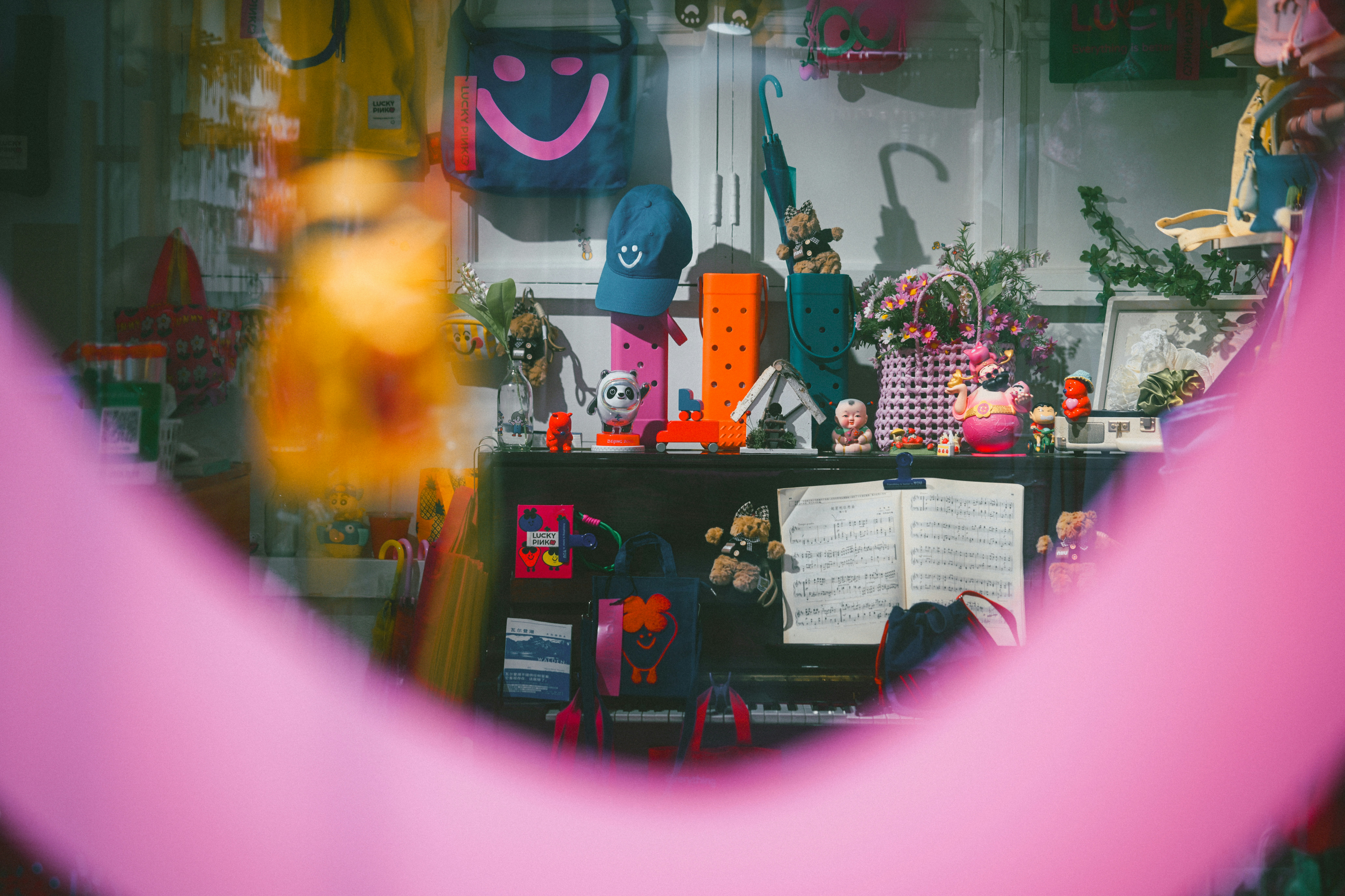 Colorful Toy Shop Window Framed by a Pink Curve