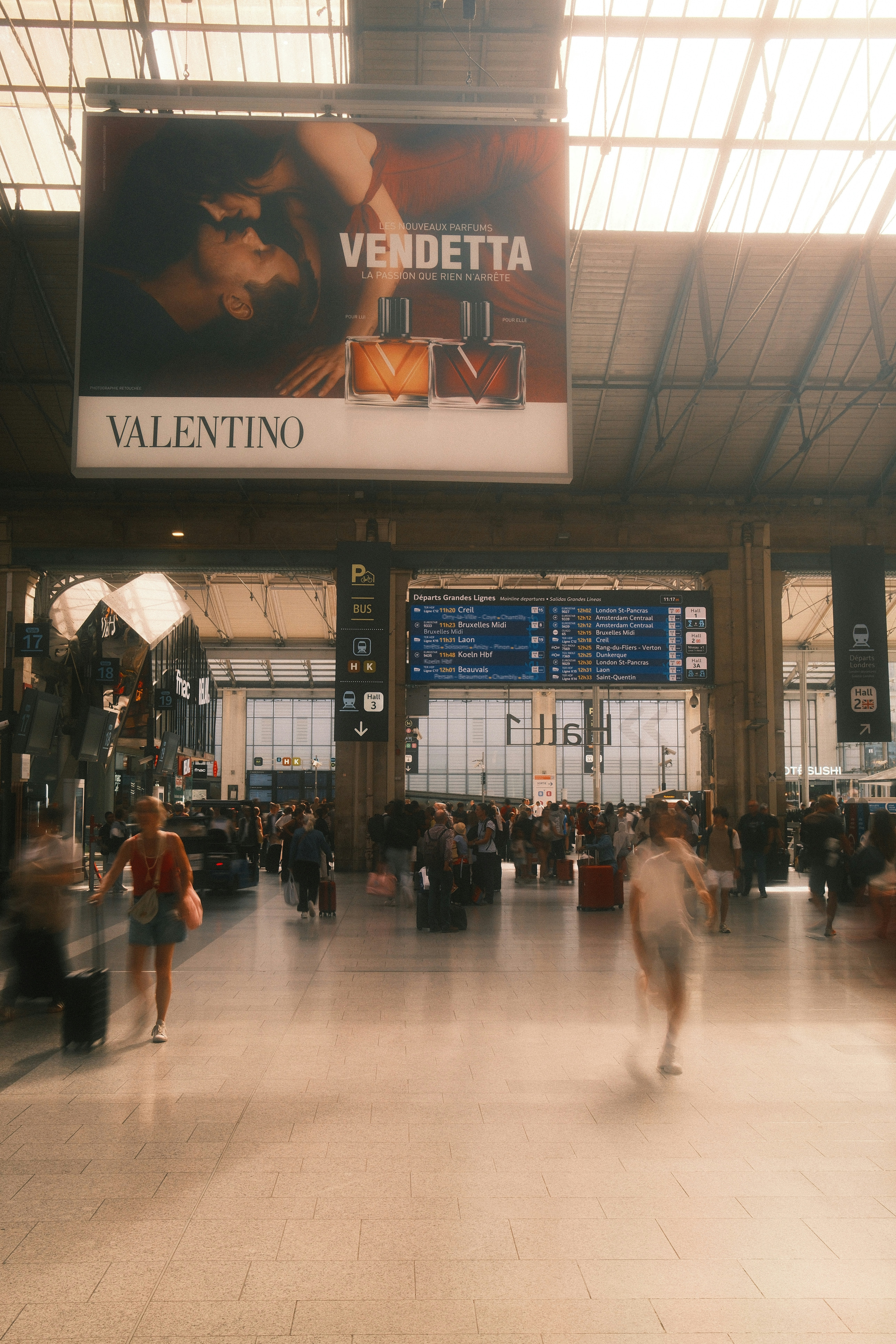 Urban Confluence: People Flow Beneath a Valentino Billboard