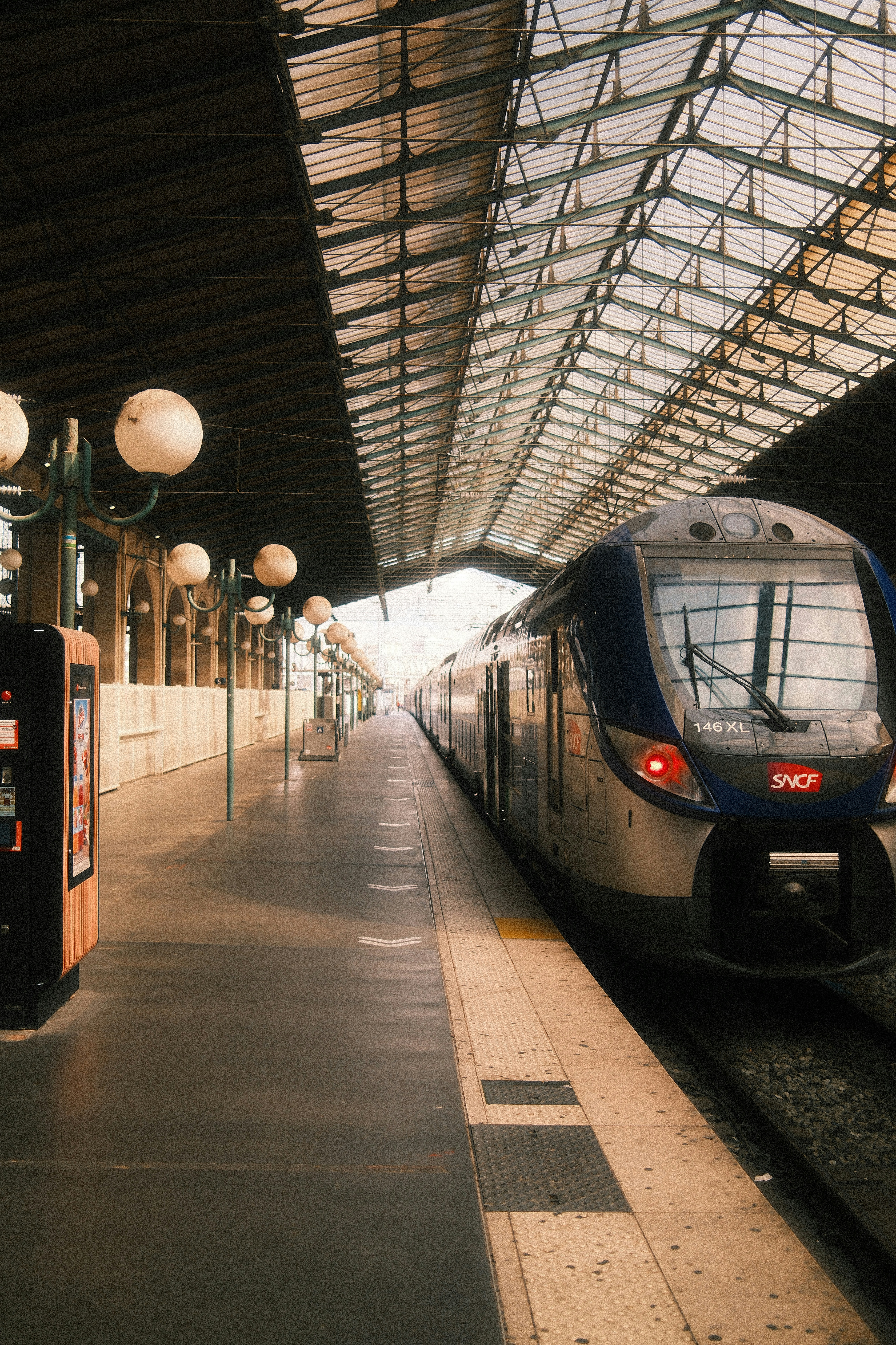 Lines of Arrival: A Train at the Glass-Canopied Platform