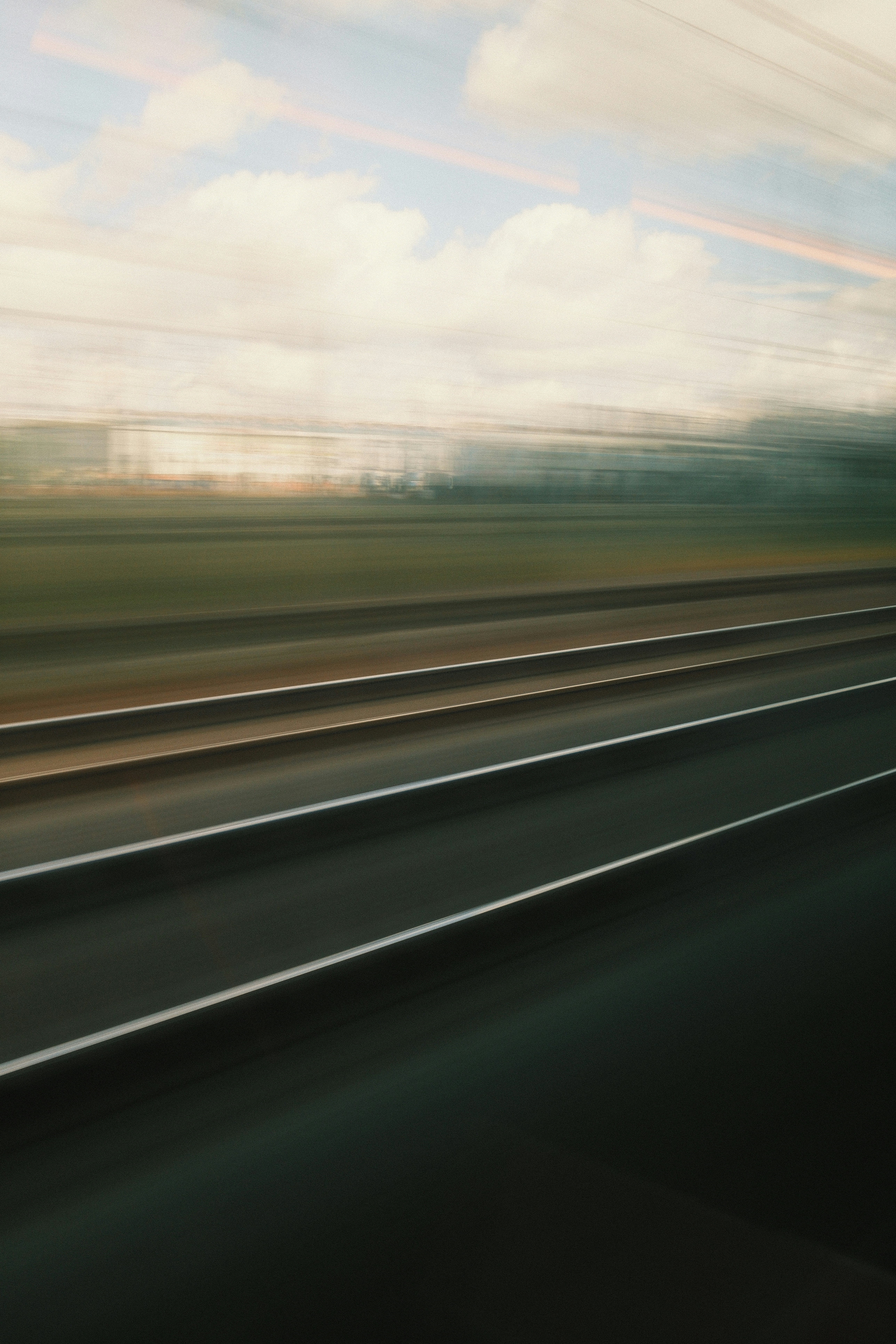 Railway on the Move: A Blurred Moment Across the Tracks