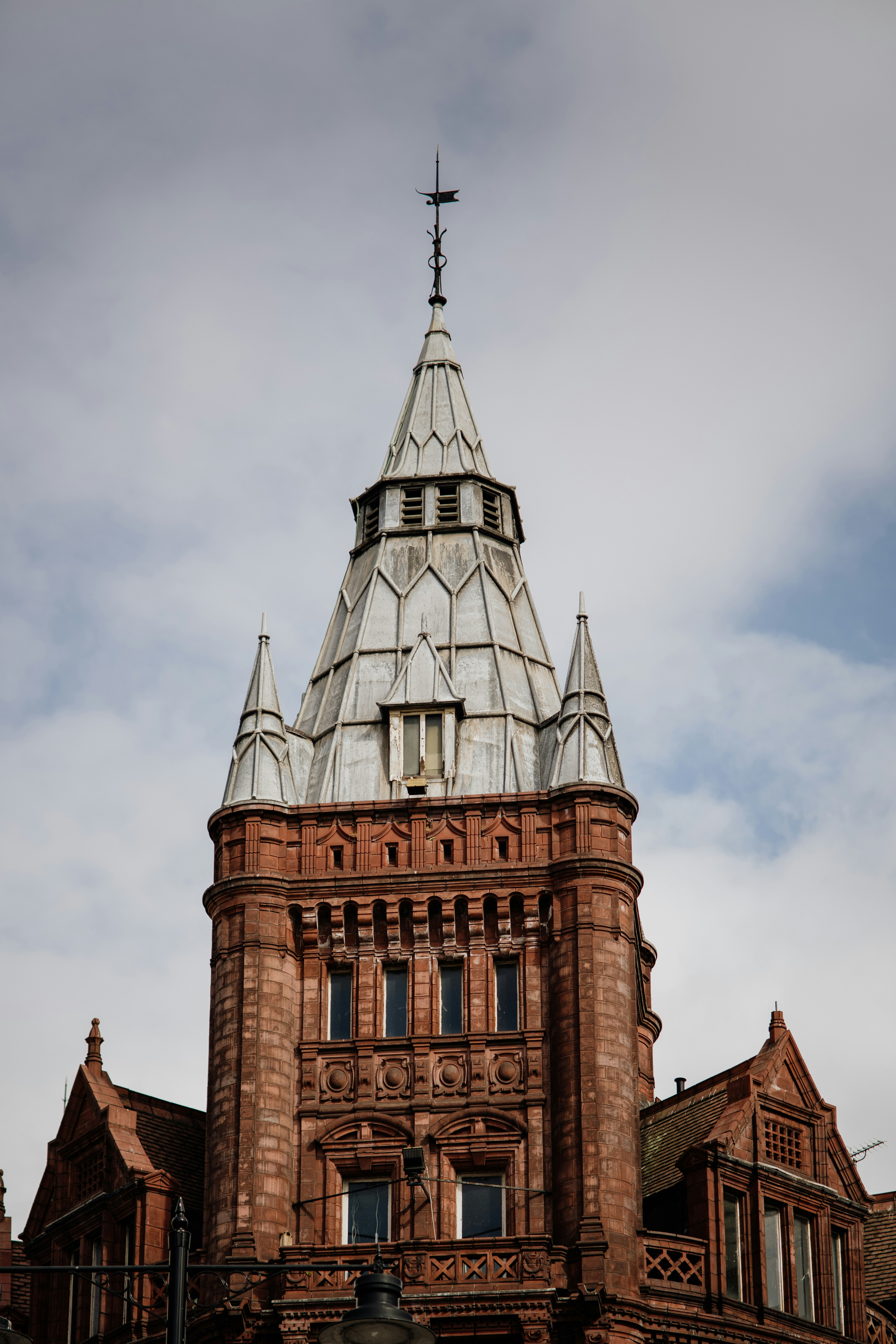 Towering Red Brick and Silver Spire