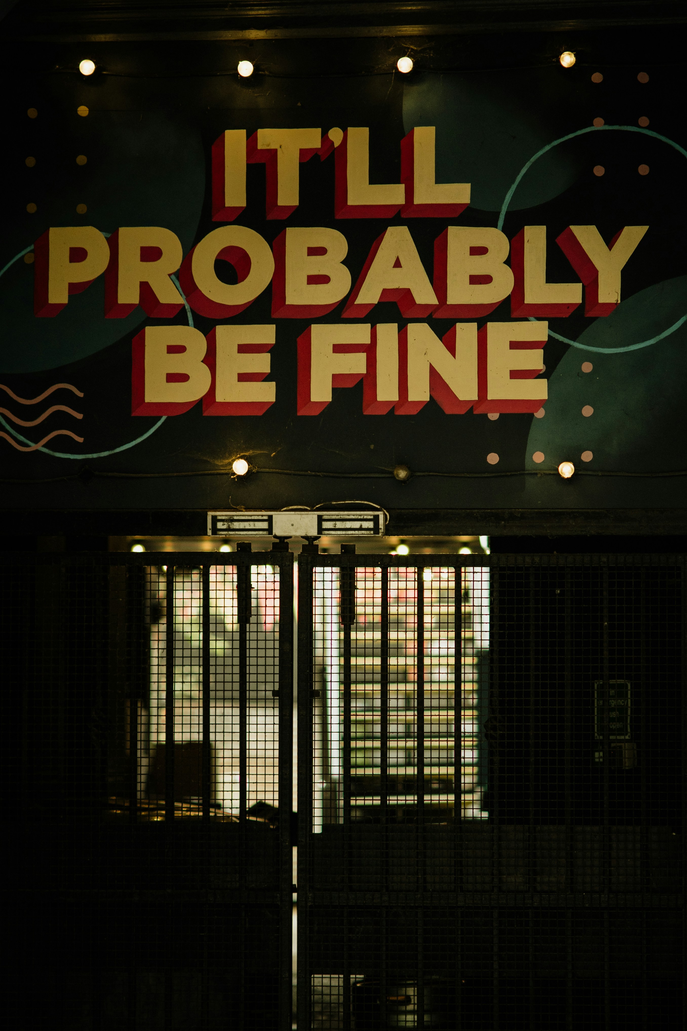 Locked Gate, Neon Banner: A Quiet Entrance to the Night Club