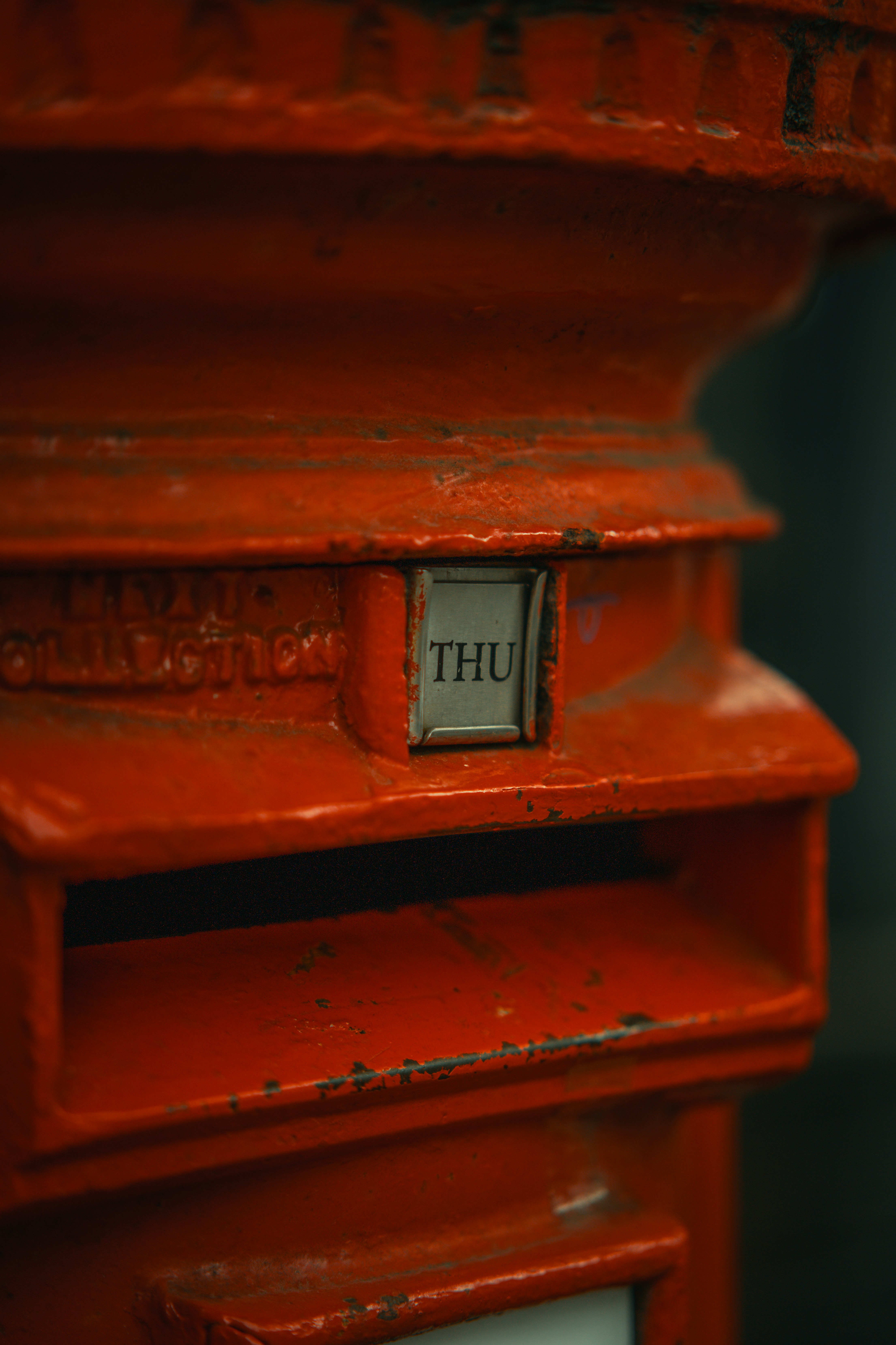A Red Weekend Post: The THU Button on a Weathered Mailbox