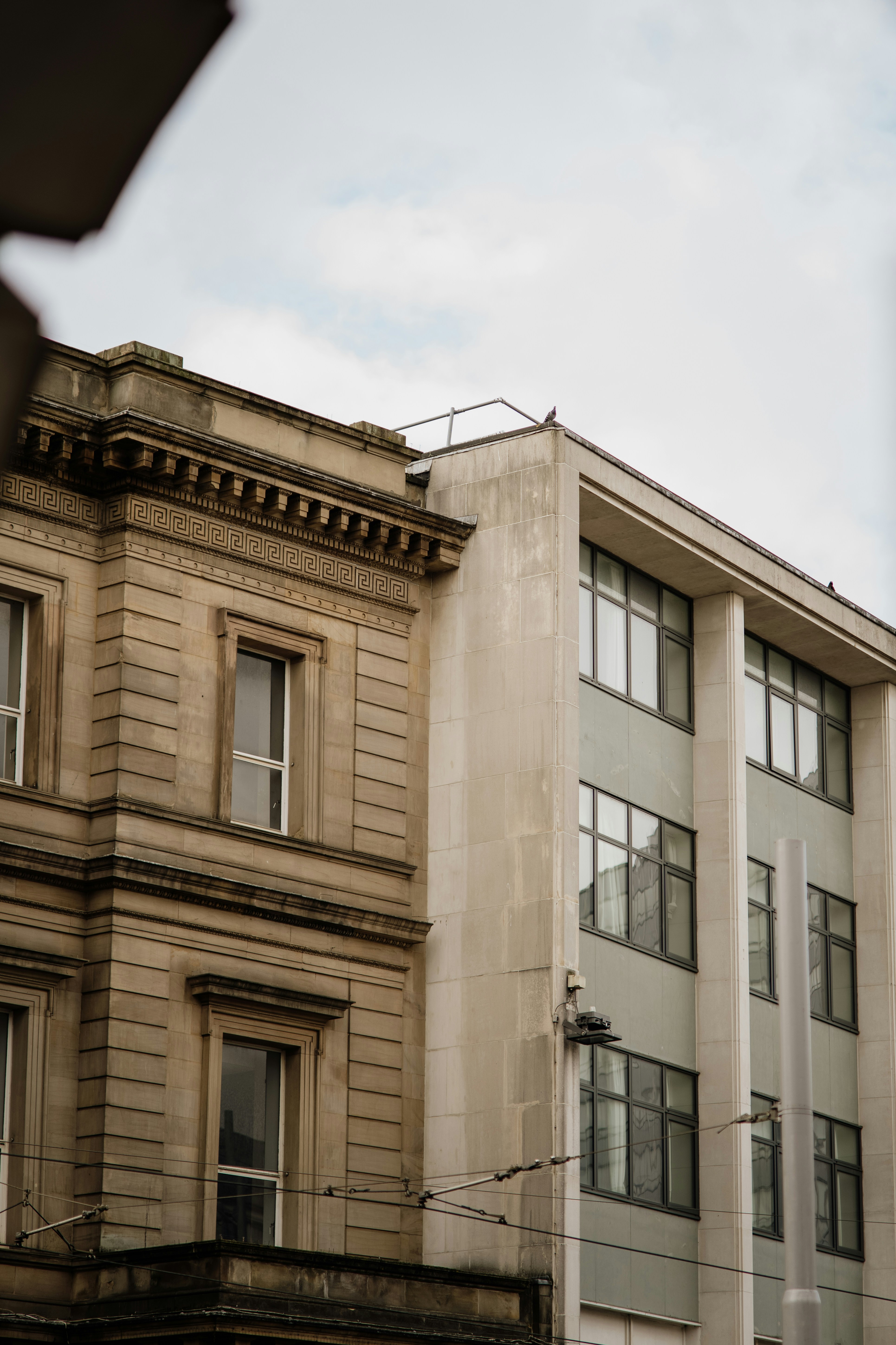 Cornerstone of Concrete: A City Block Between Stone and Glass