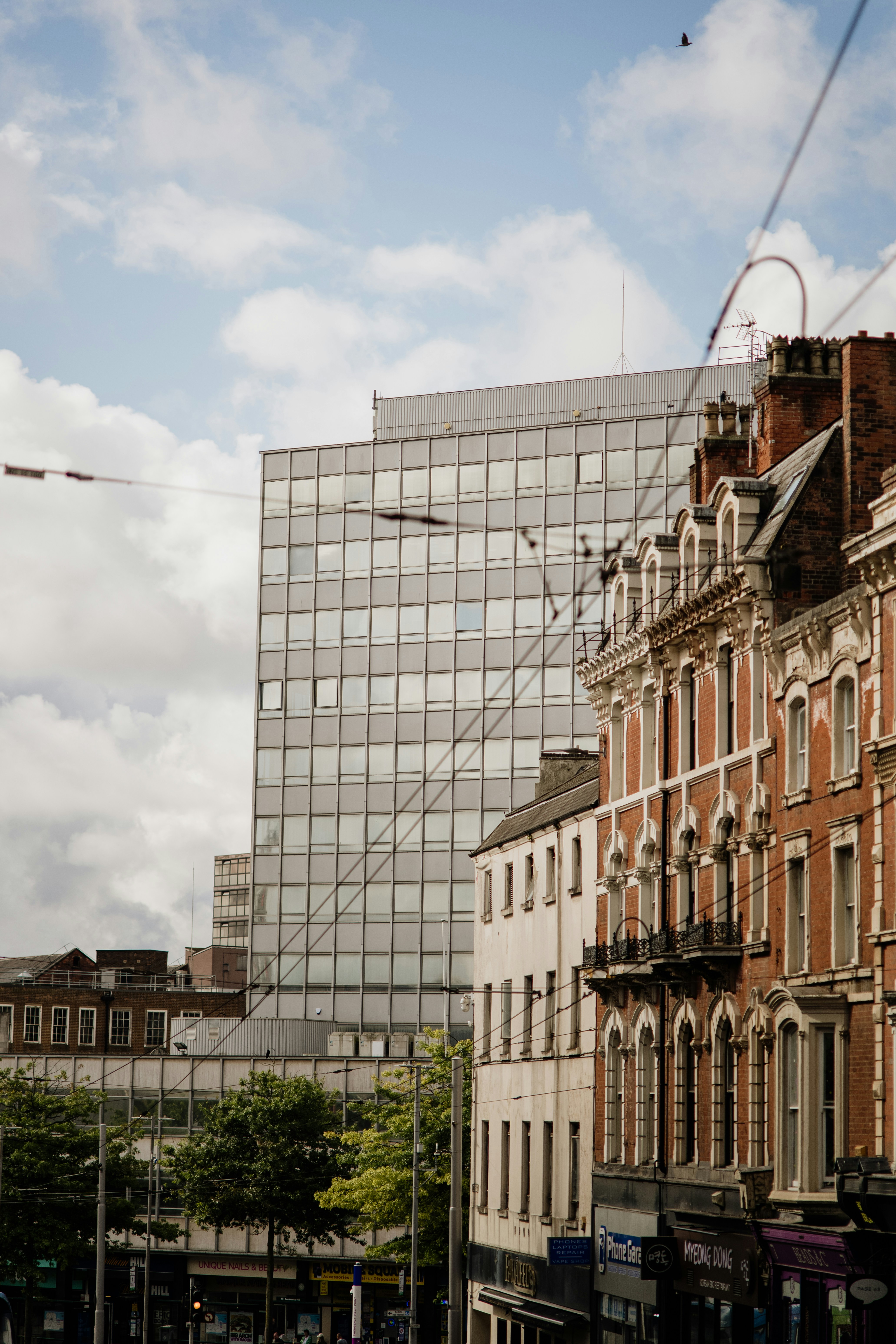 Urban Crossroads: Glass Faces and Brick Heritage