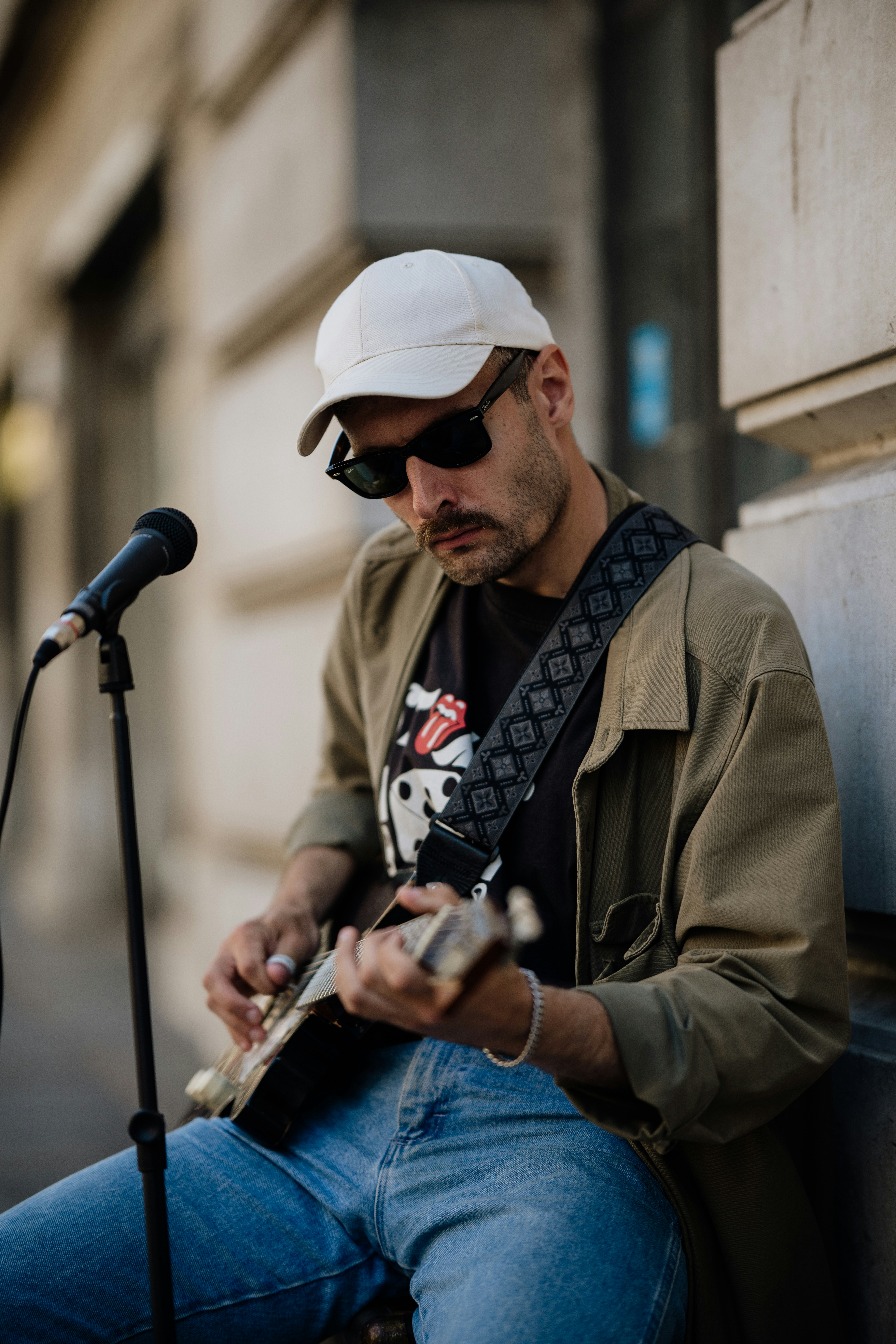 Guitarist in Street Light: Quiet Focus Under Urban Canopy