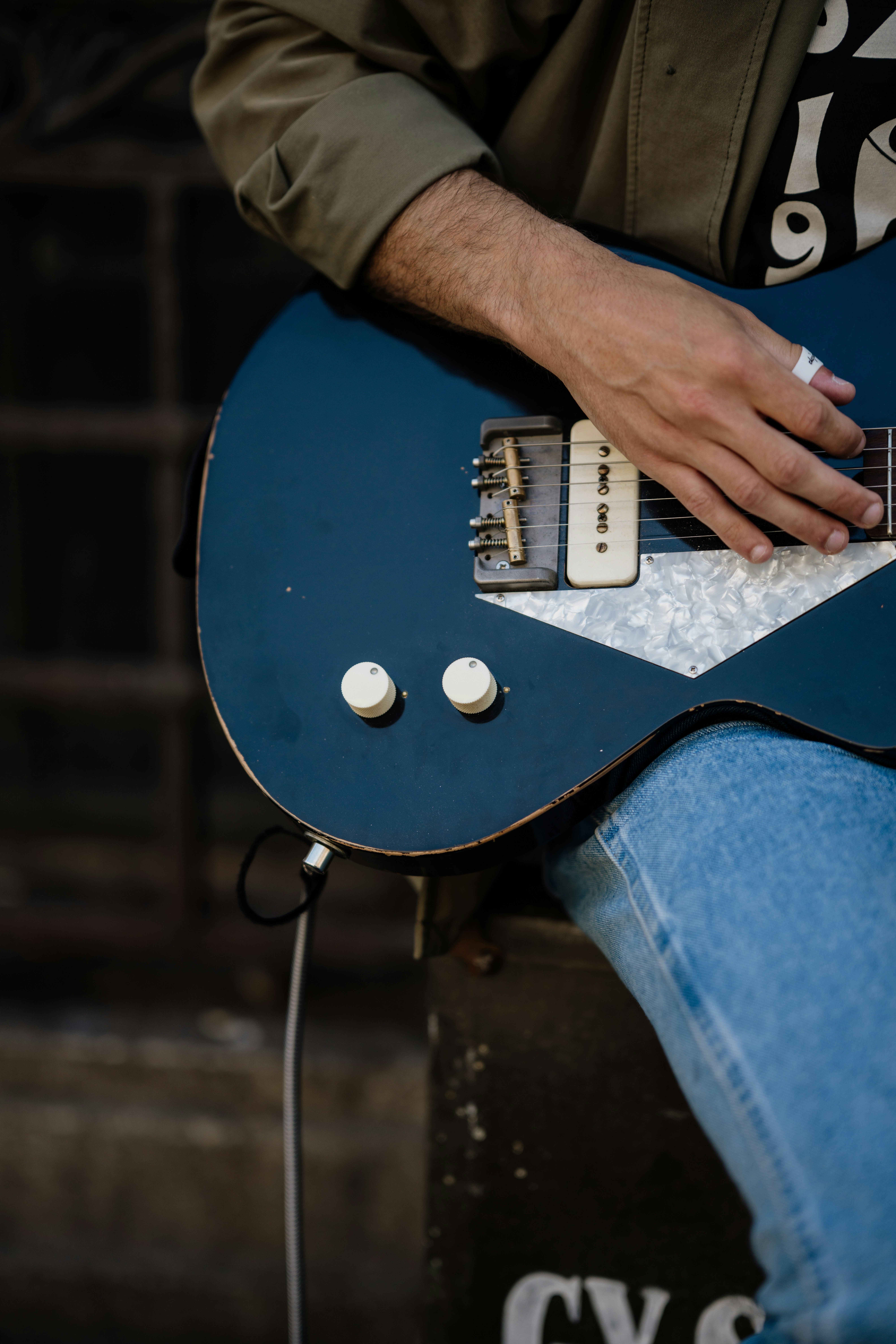 Blue Strat Strums: Close-Up on a Guitars–Hands Connection