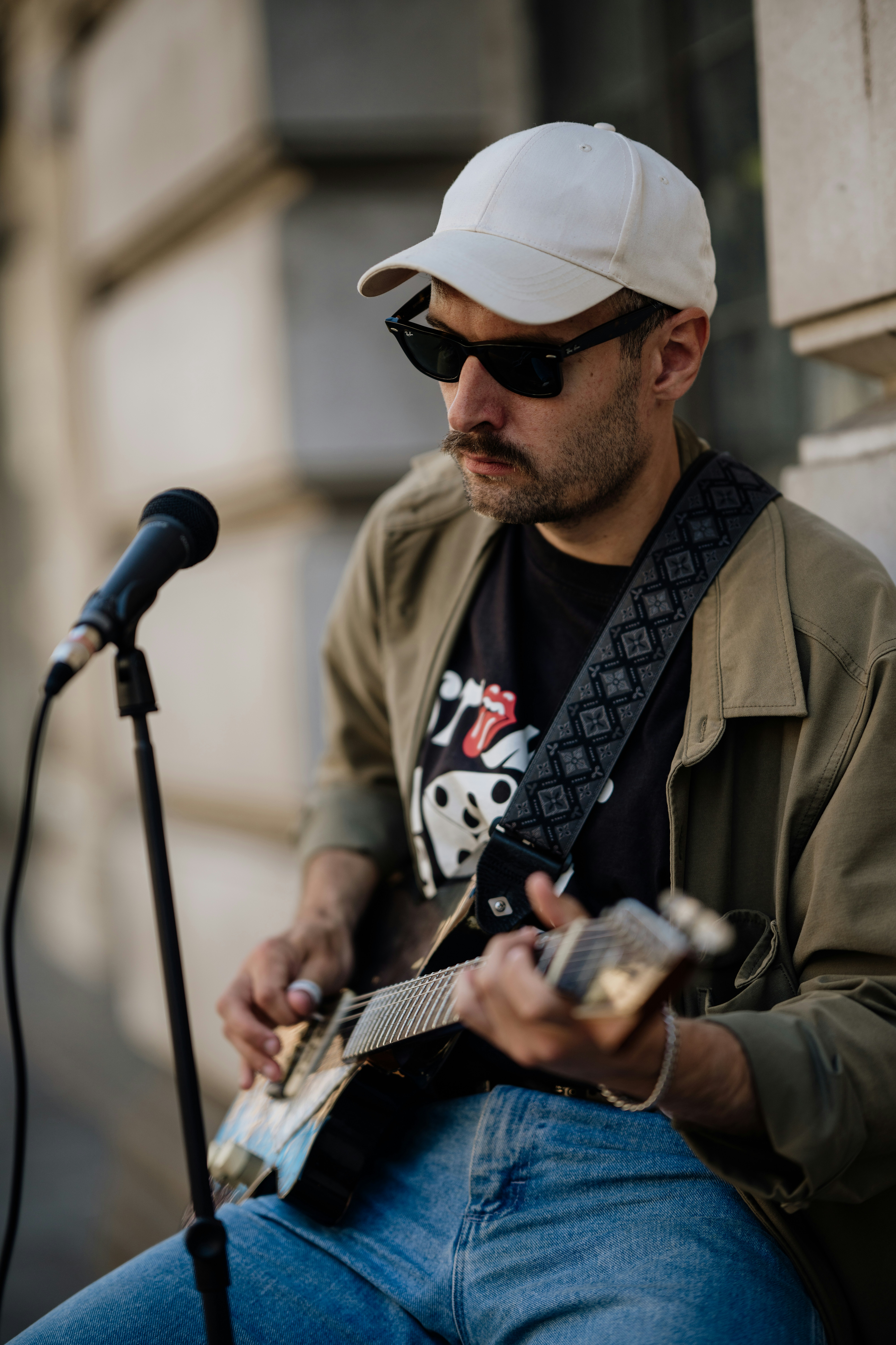Midnight Strums: A guitarist lost in the groove at the avenue edge