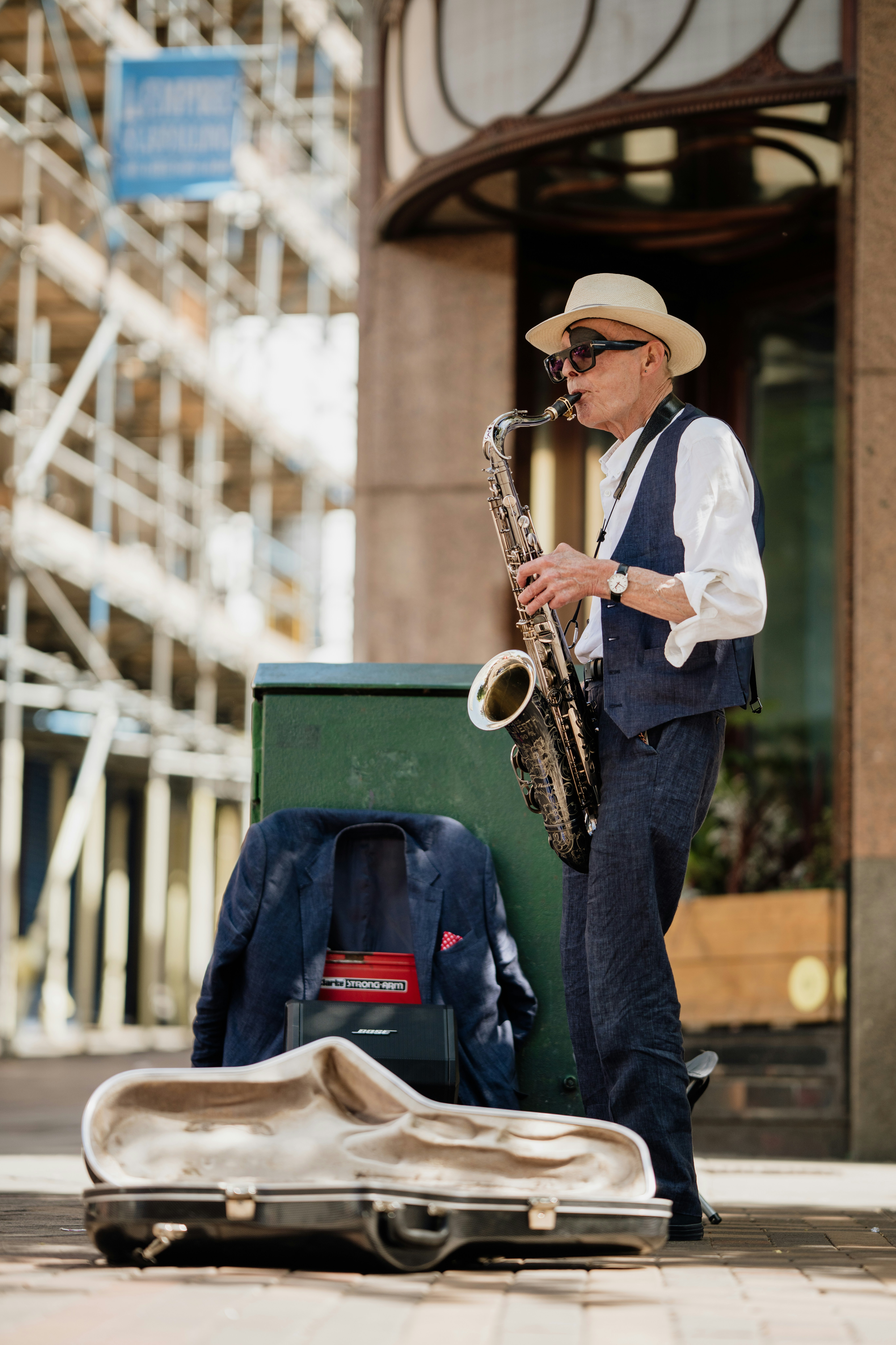 Street Saxophonist in Front of a City Facade