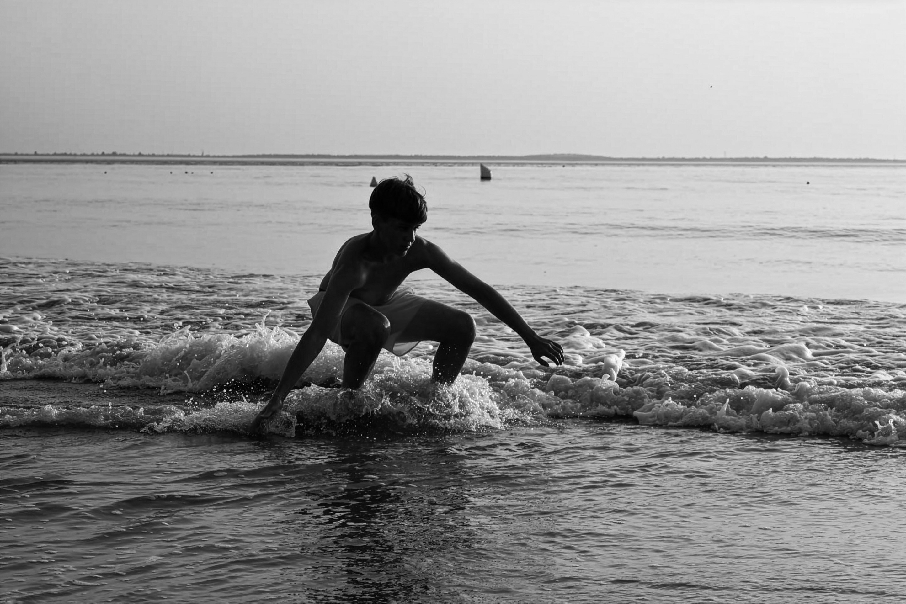 Surfacing Silhouette: A Quiet Kick at the Sea’s Edge