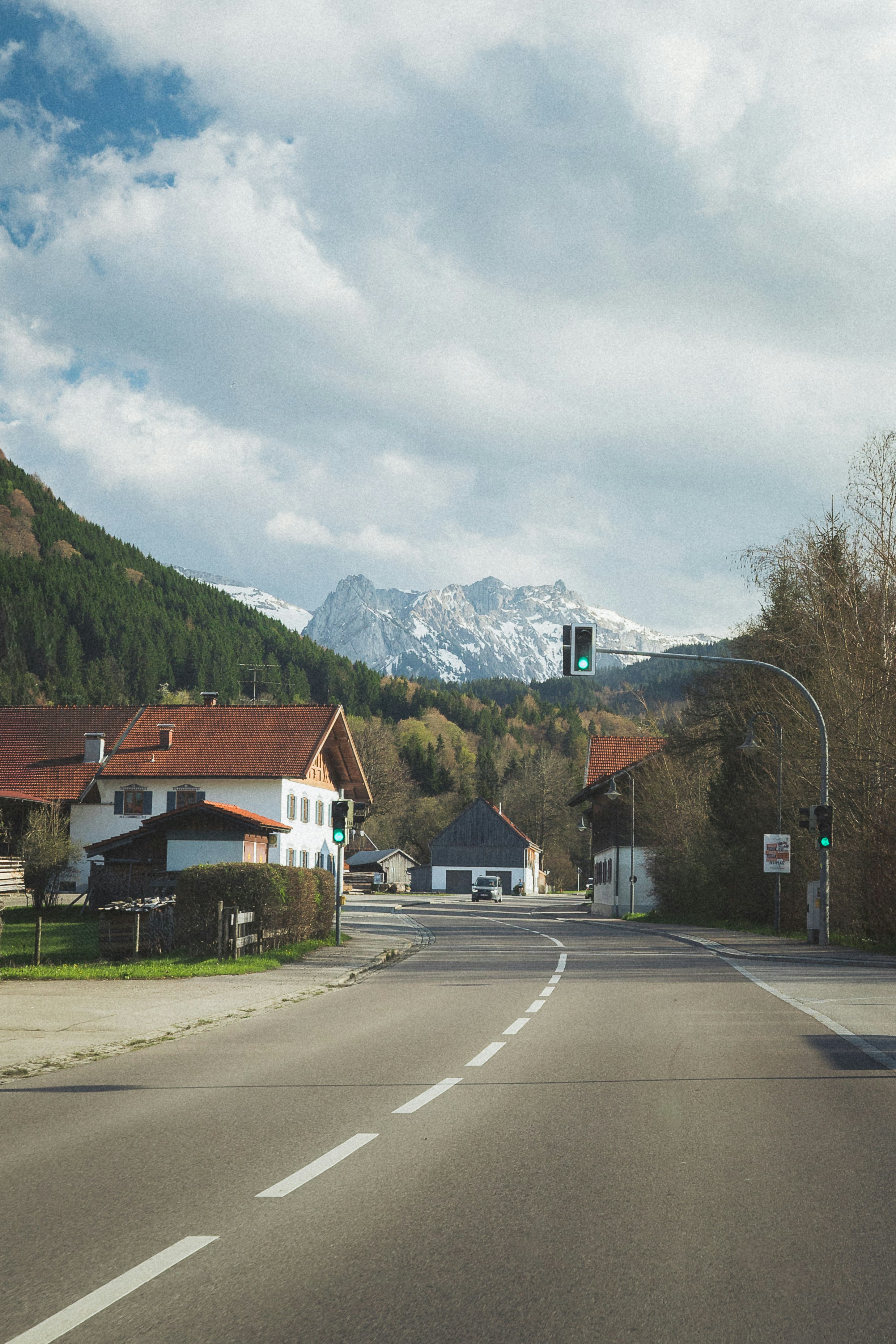 Road to the Crest: A Quiet Alpine Town Under Open Sky